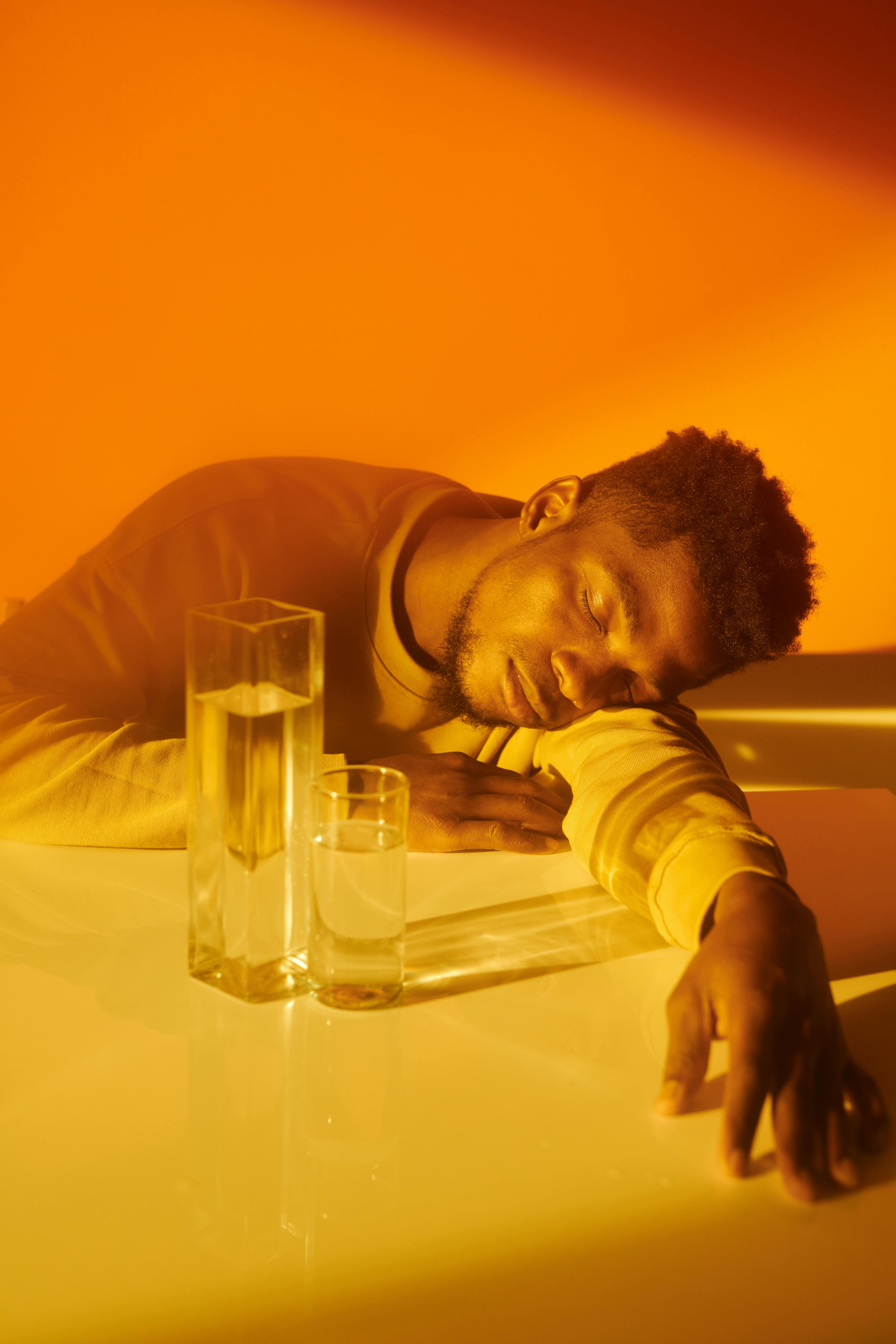 A Man Sleeping on a Table · Free Stock Photo