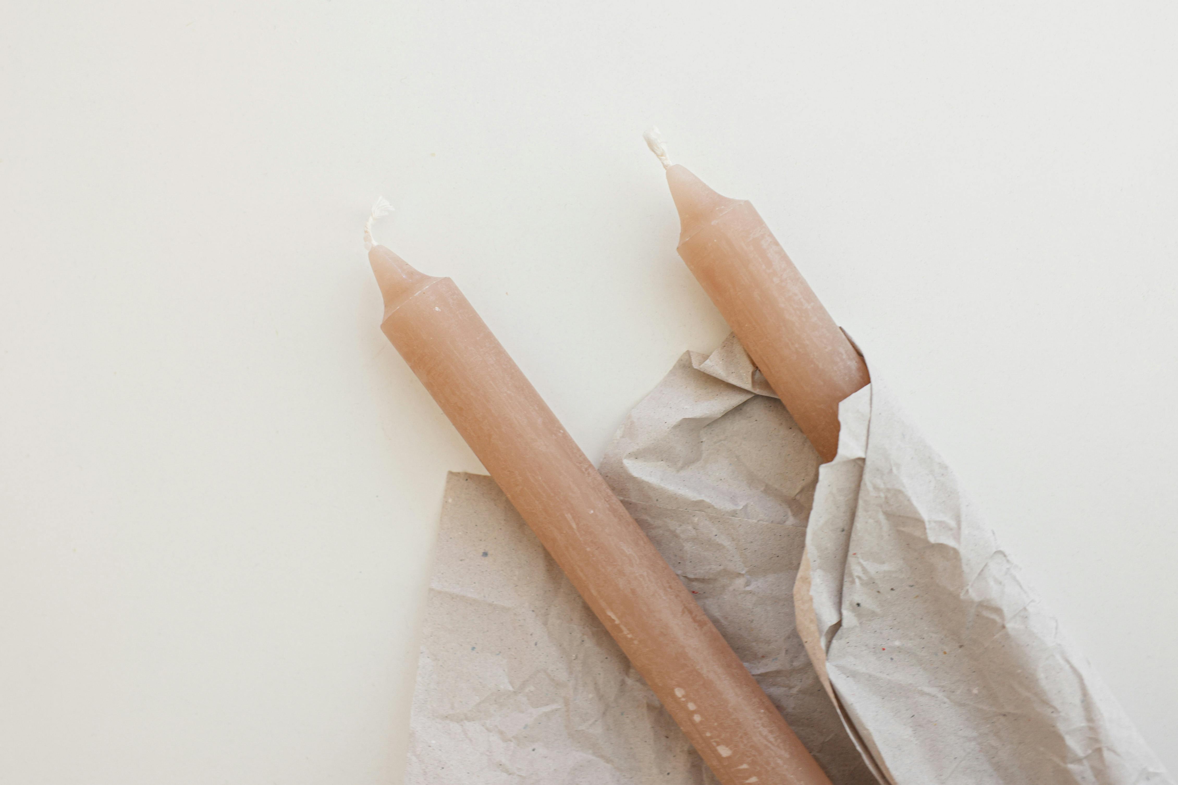 Brown Candlesticks Wrapped on Paper · Free Stock Photo