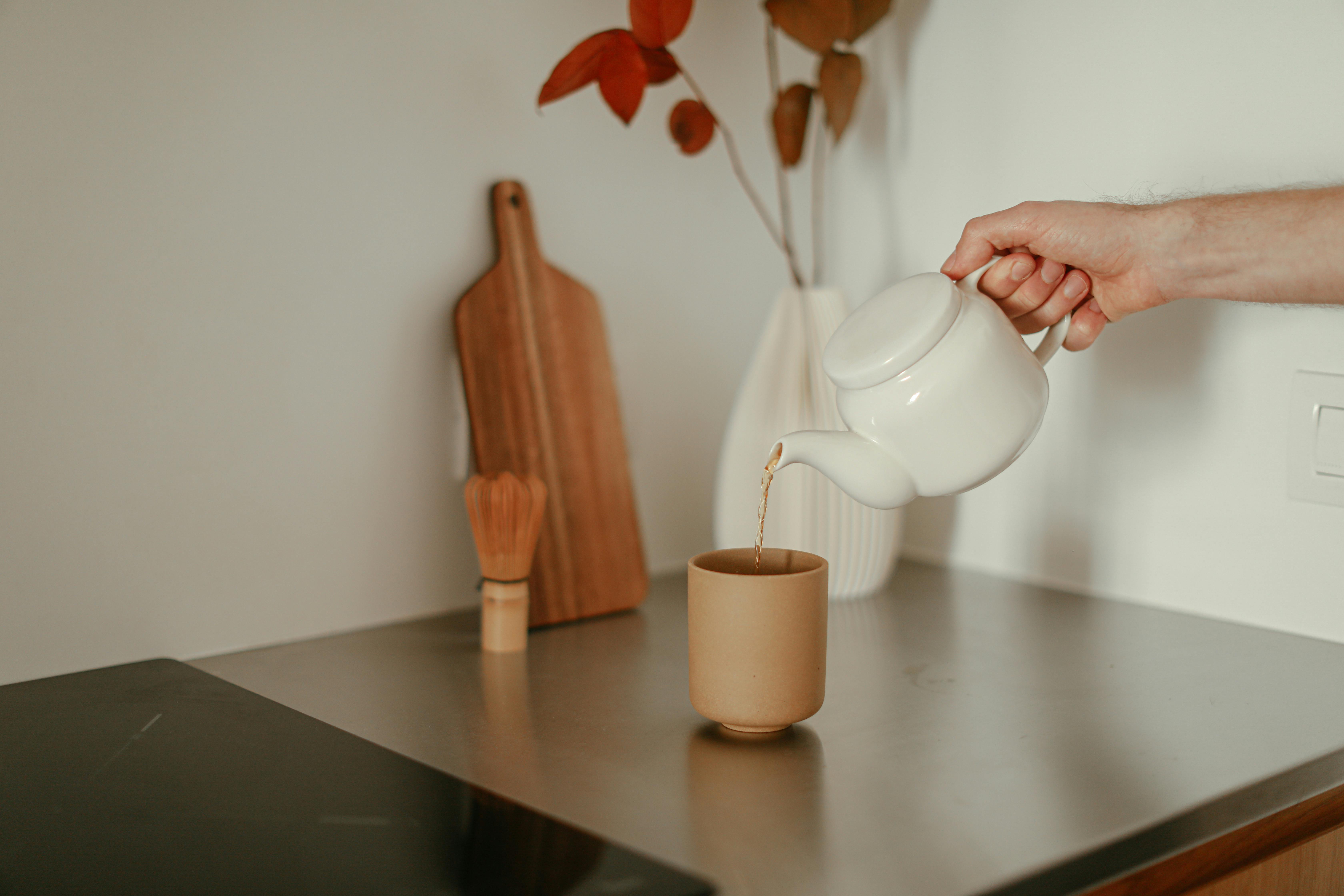 Person Pouring Tea · Free Stock Photo
