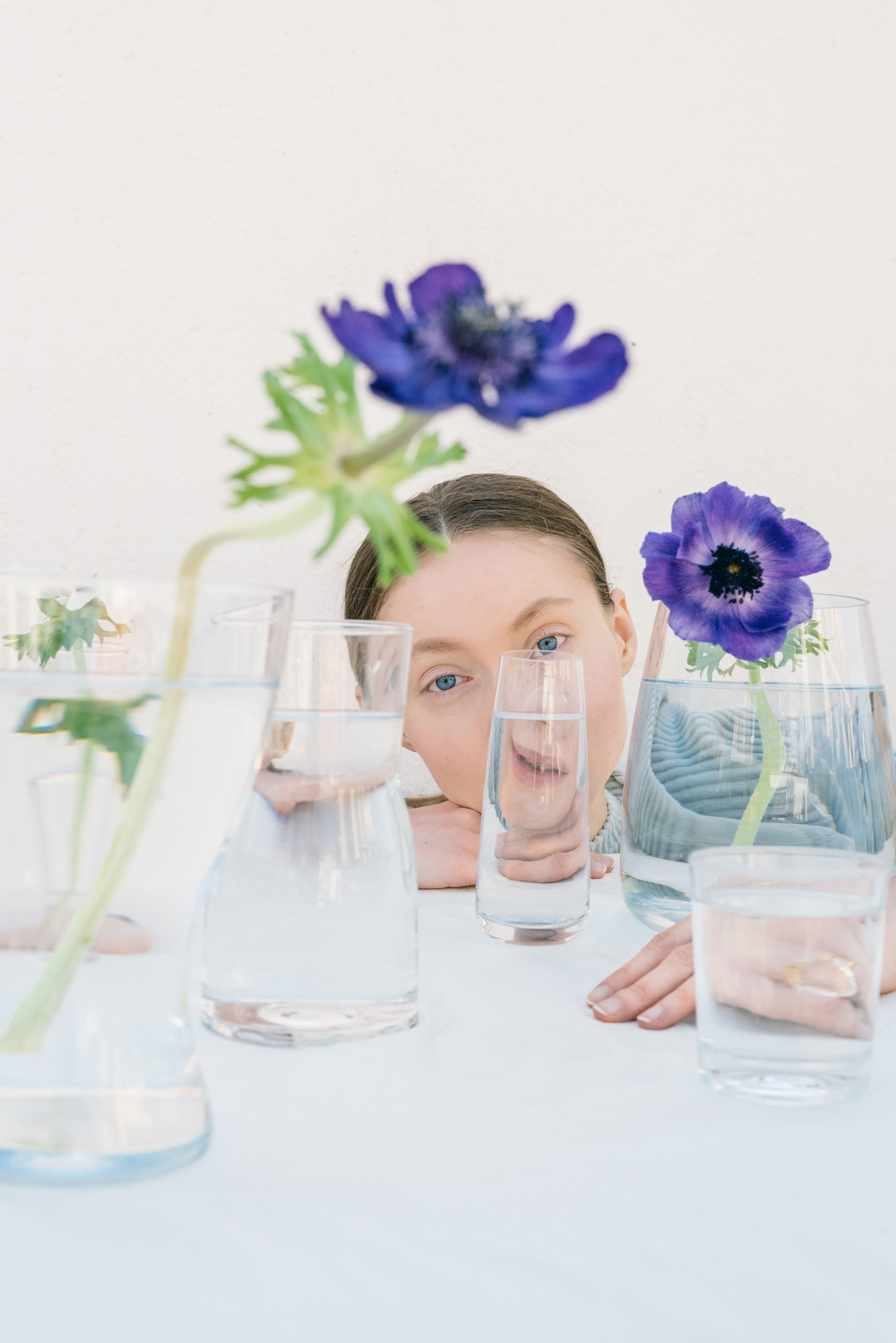 Woman Holding a Yellow Dandelion front of Her Face · Free Stock Photo