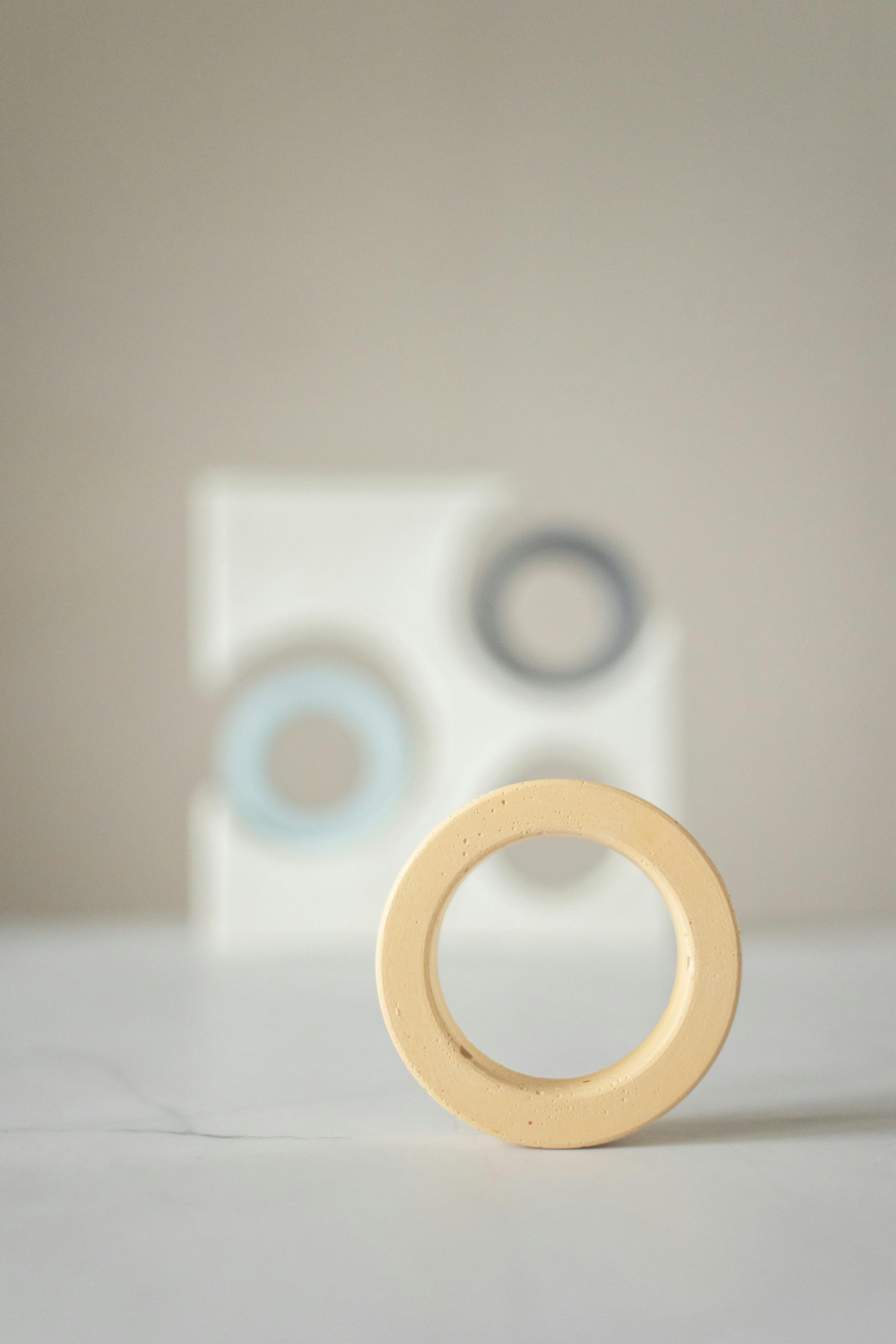 Photo of a Beige Ring on a White Surface · Free Stock Photo