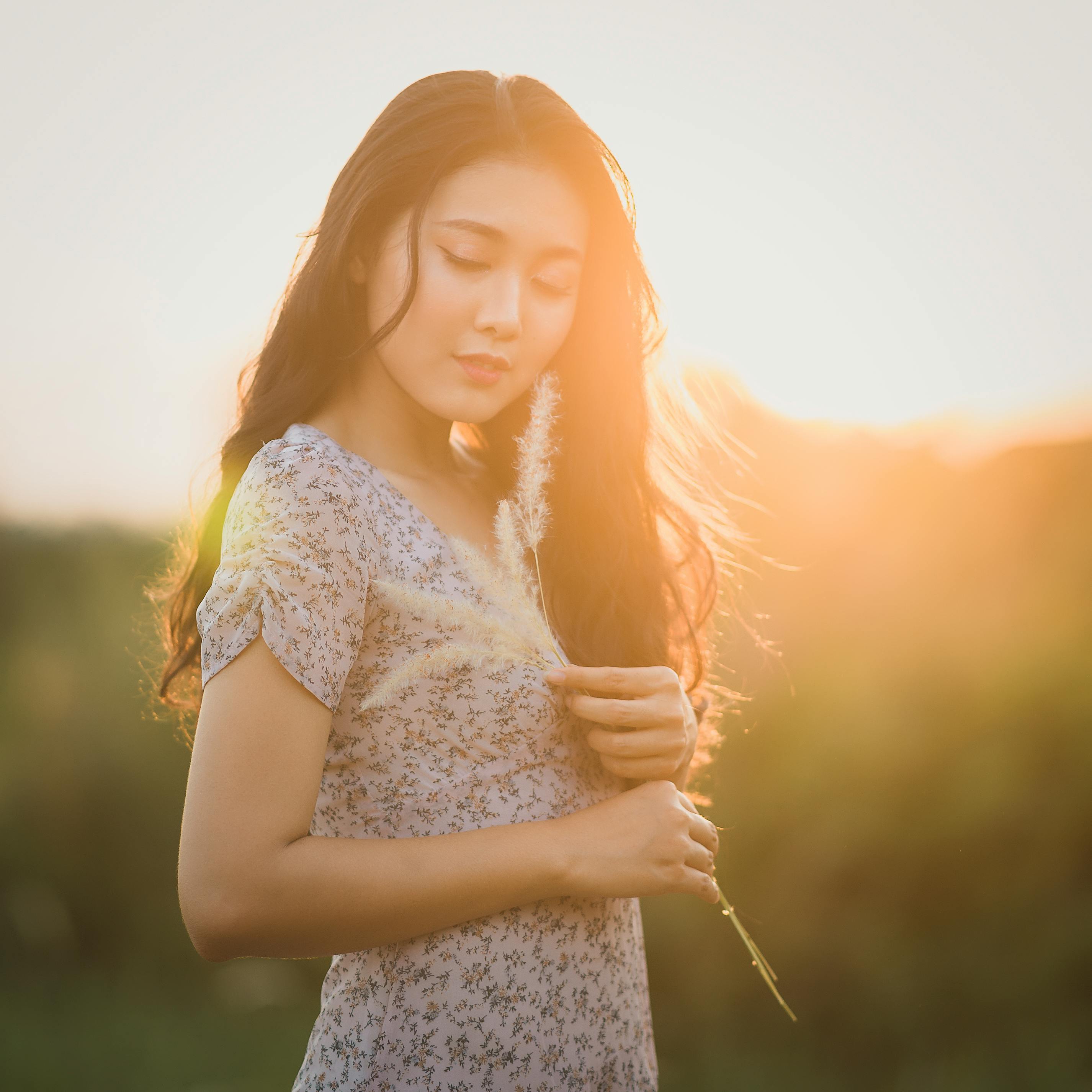 Faceless ethnic woman covering eyes with veil in nature · Free Stock Photo