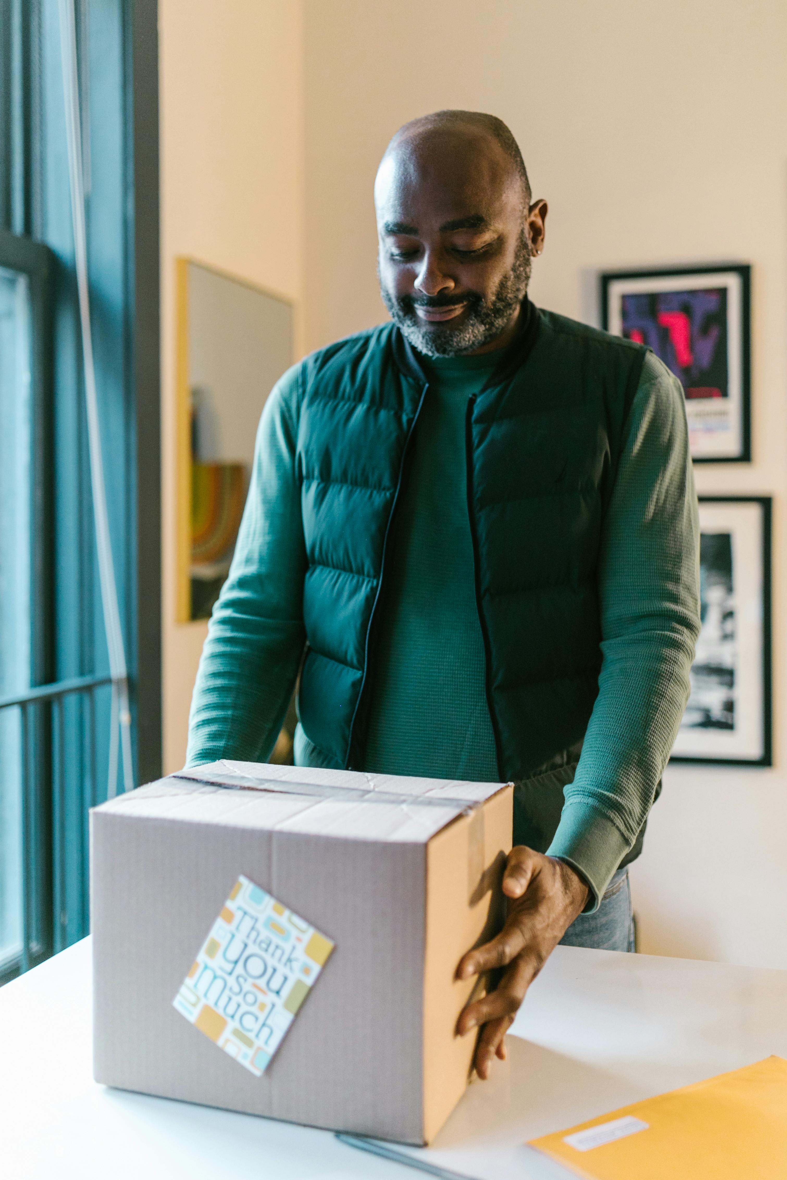 Man Holding a Box · Free Stock Photo