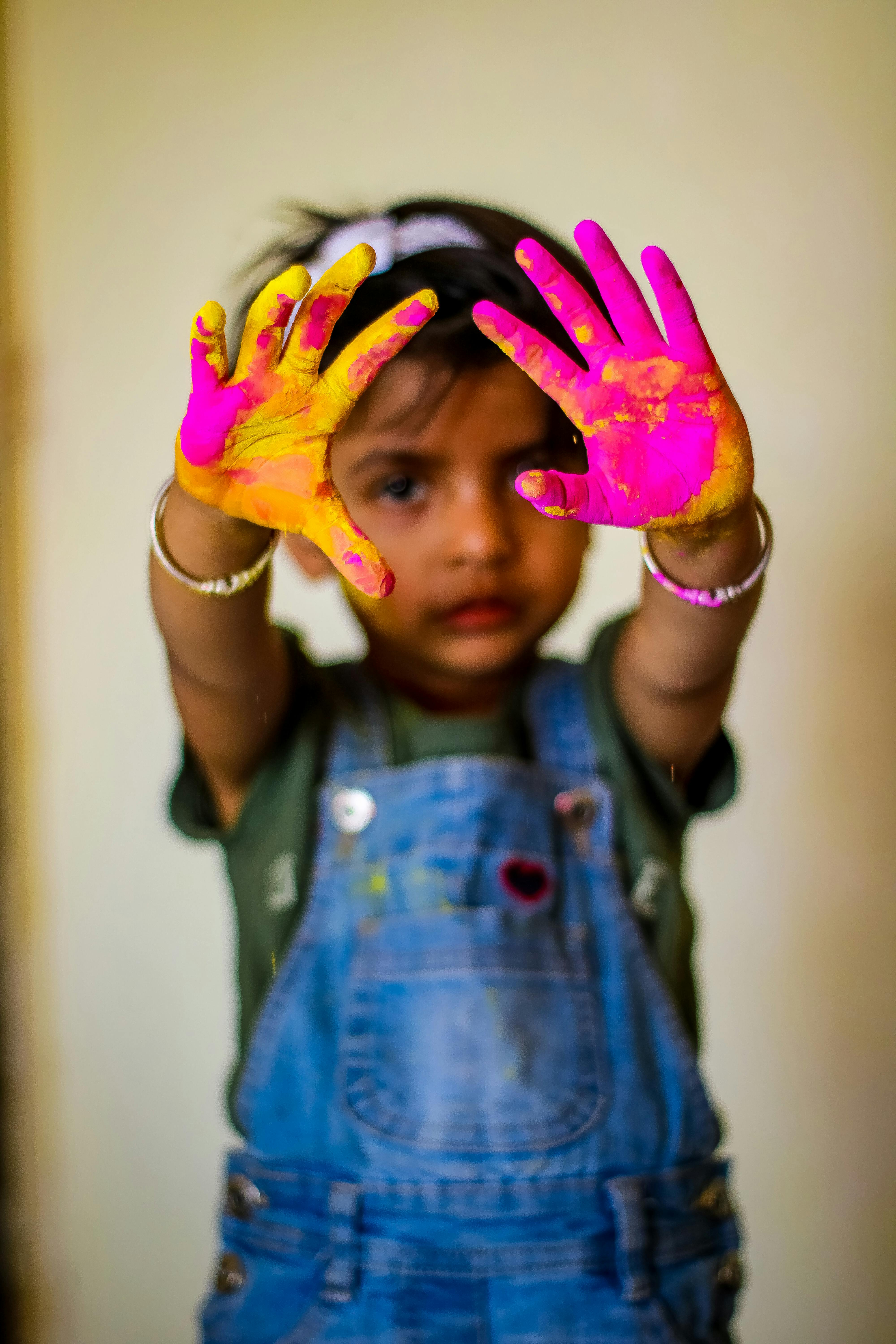 Cute Little Girl with Colored Powder on Face · Free Stock Photo
