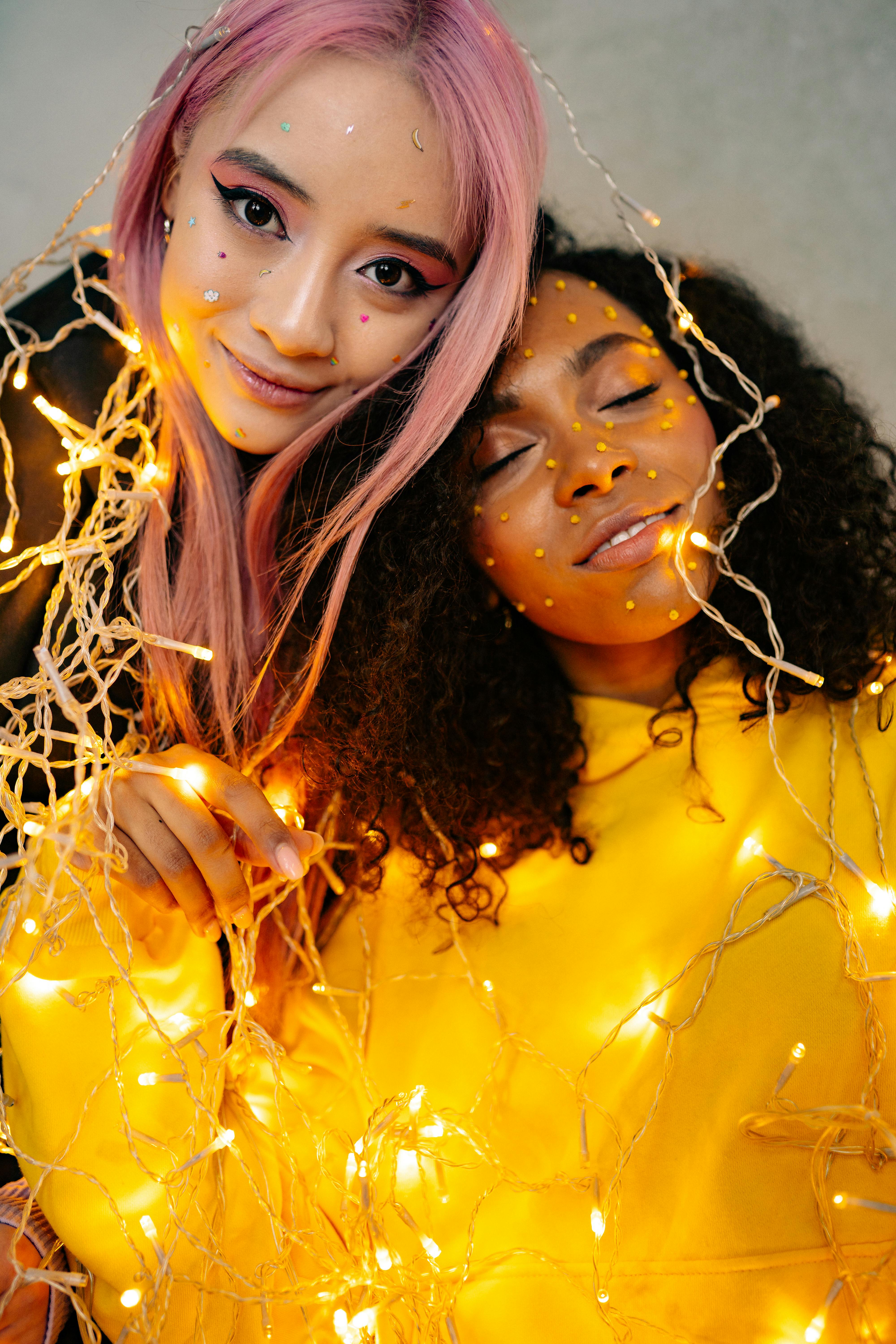 Women with String Lights Wrapped Around them · Free Stock Photo