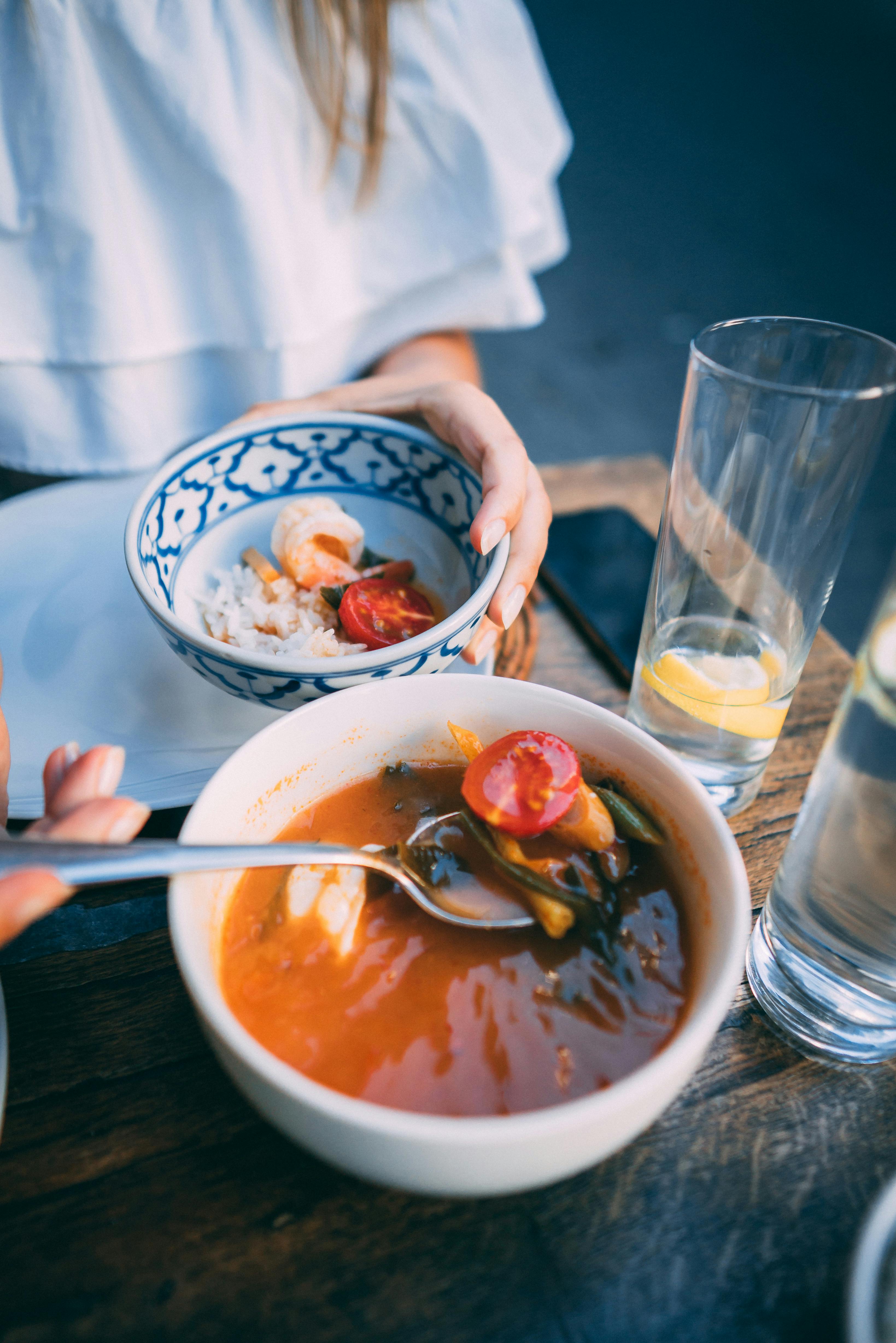 A Person Eating a Rice congee · Free Stock Photo