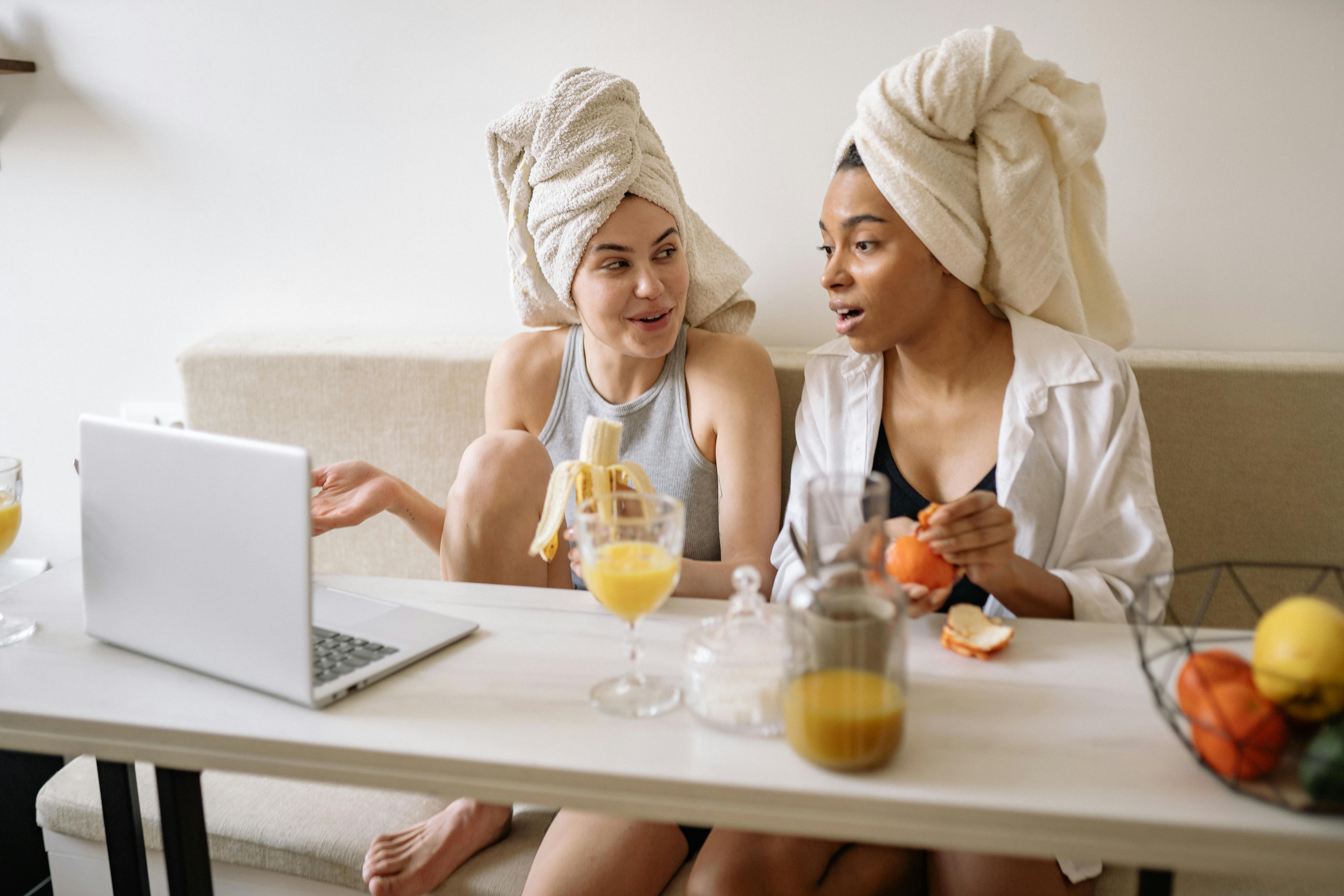 Women Eating Fruits While Wearing Towels on Their Head · Free Stock Photo