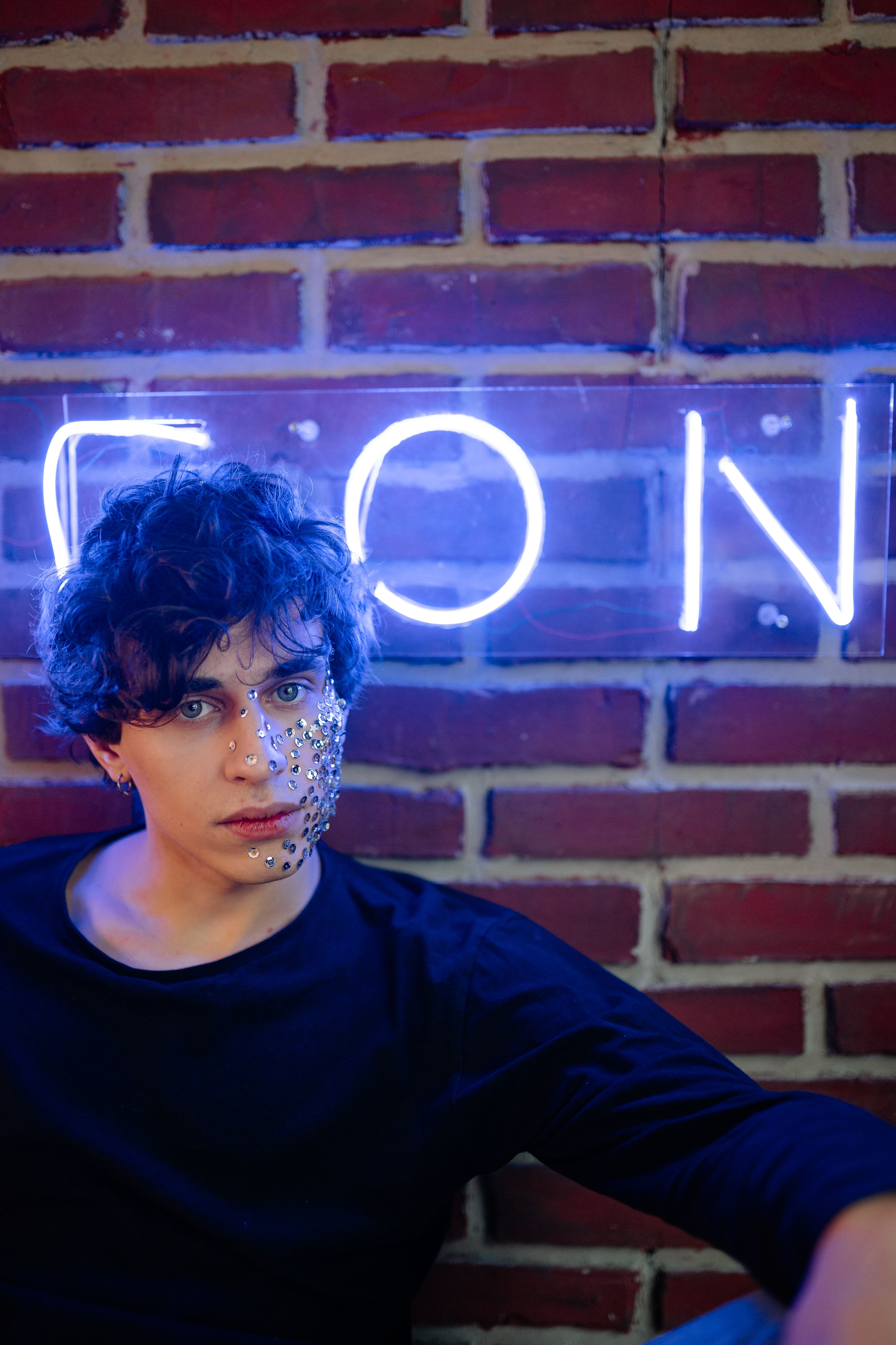 A Man with Sequins on His Face · Free Stock Photo