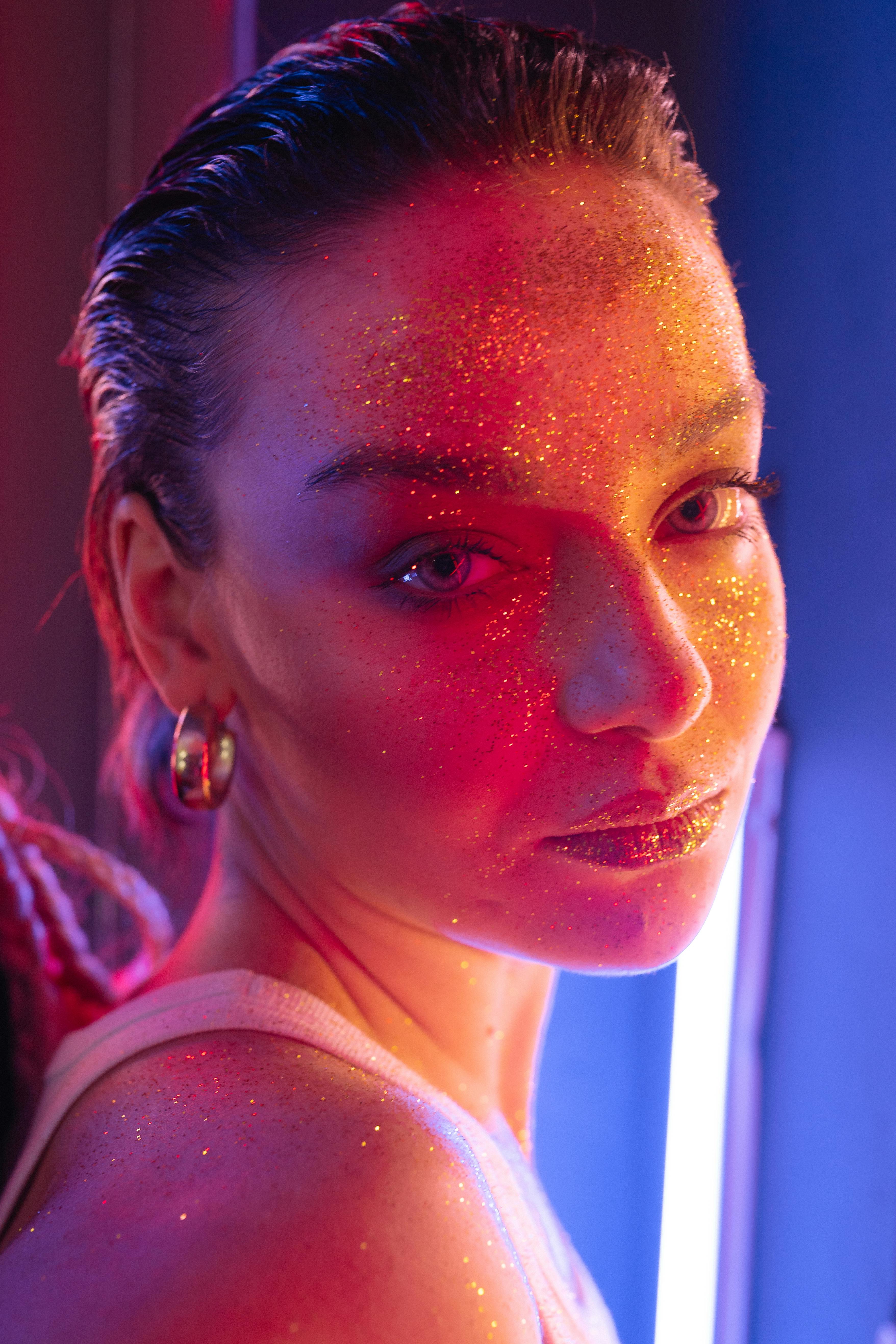 Portrait of a Young Woman with Glitter on Her Face · Free Stock Photo