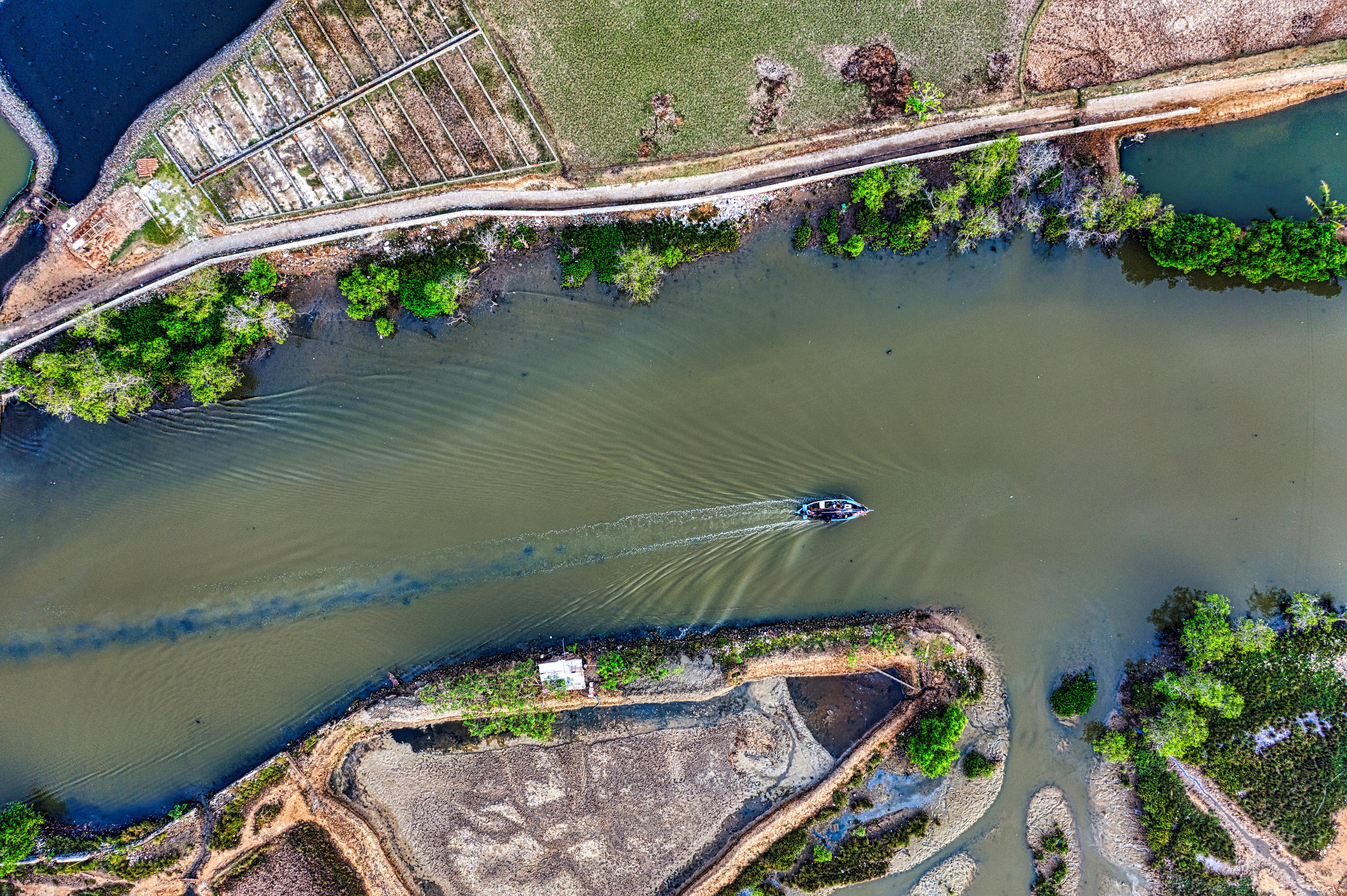 Drone Shot of a Boat on a River · Free Stock Photo