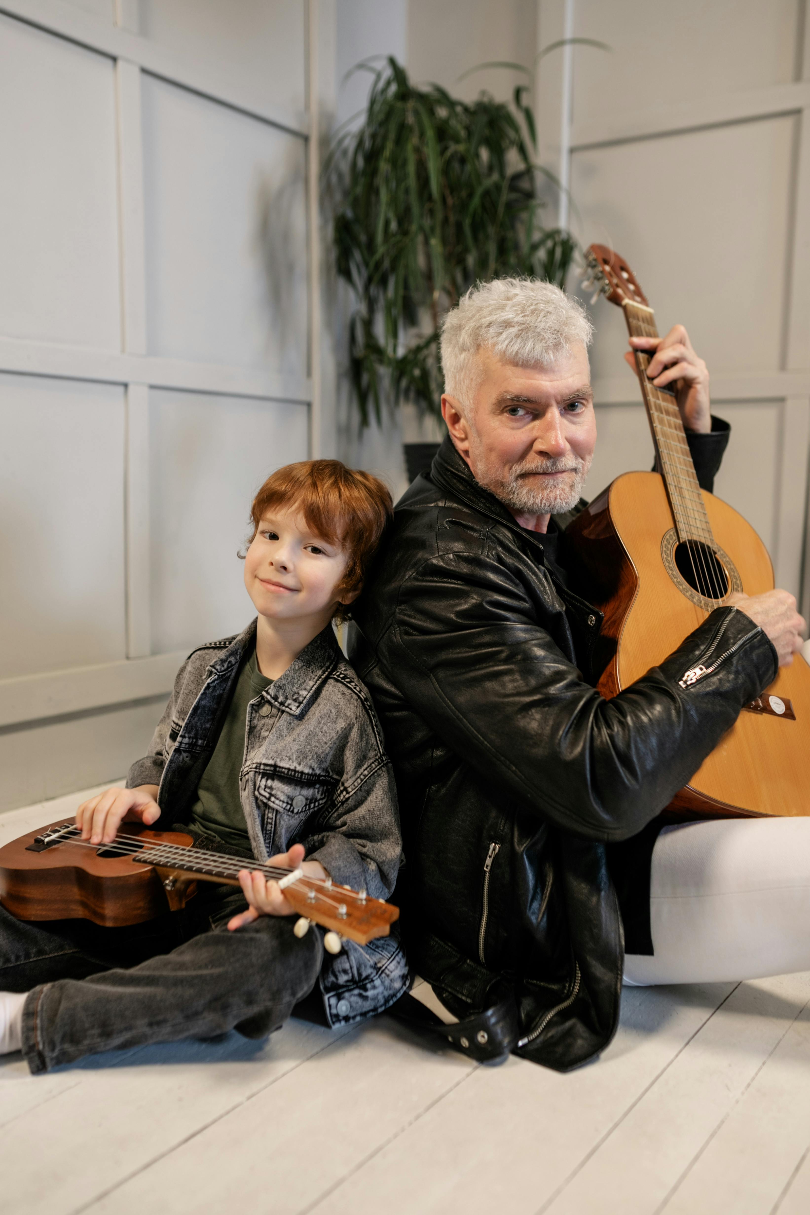 Grandfather and Grandson Holding Their String Instruments · Free Stock ...