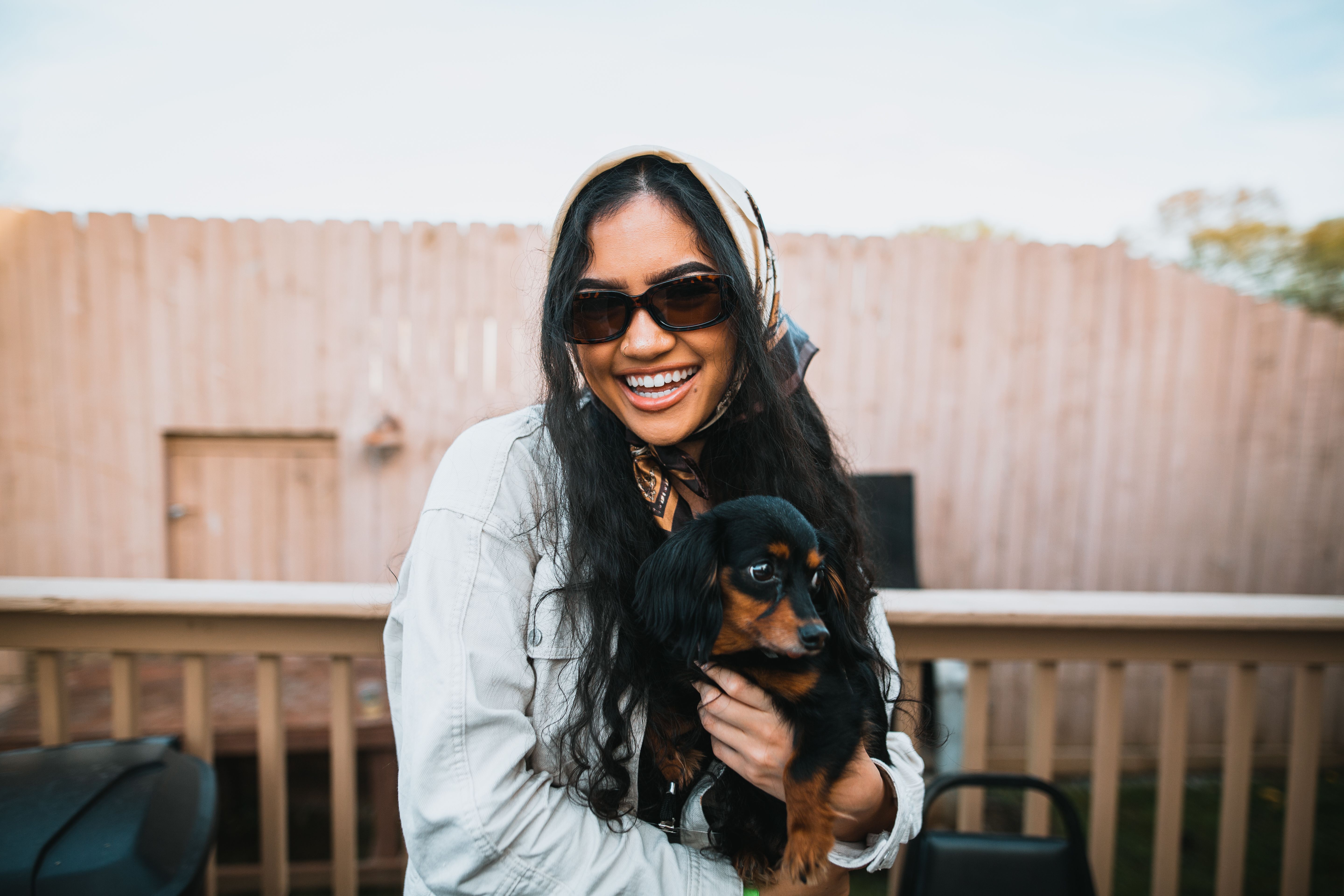 Close-Up Photo of Woman Carrying Dog · Free Stock Photo