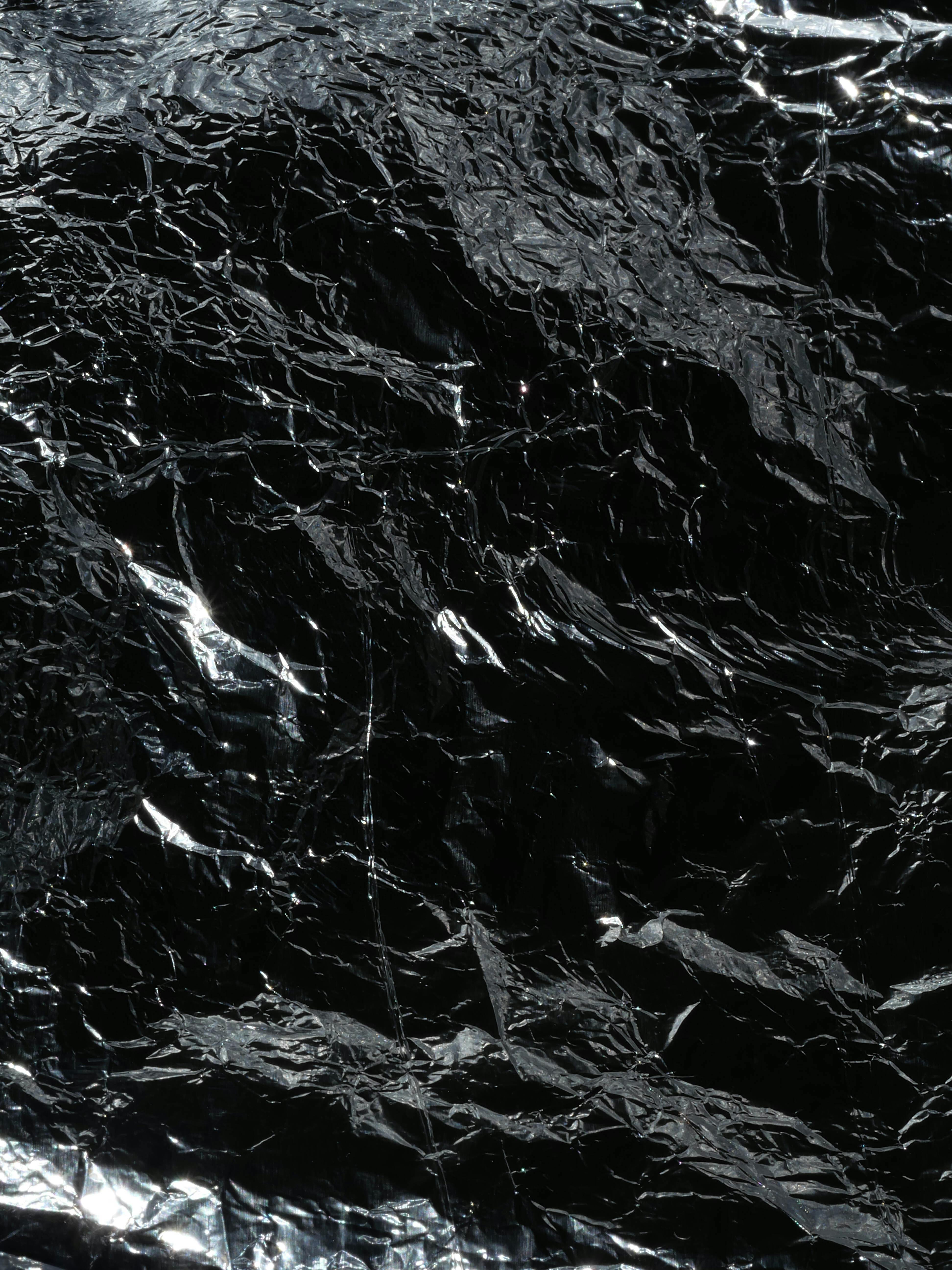 Close-Up Shot of a Wrinkled Foil · Free Stock Photo