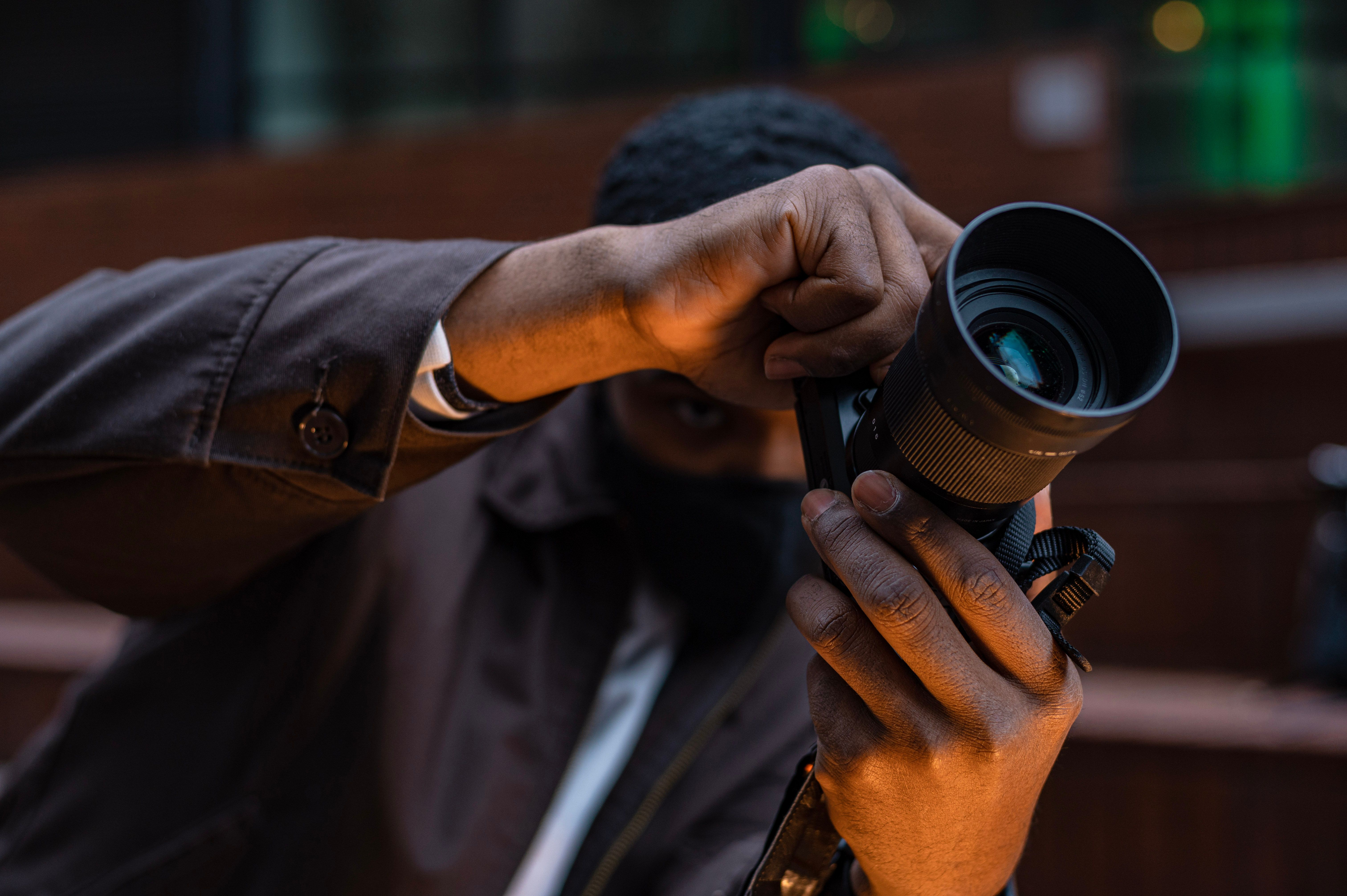 Photo of Man Capturing a Photo · Free Stock Photo