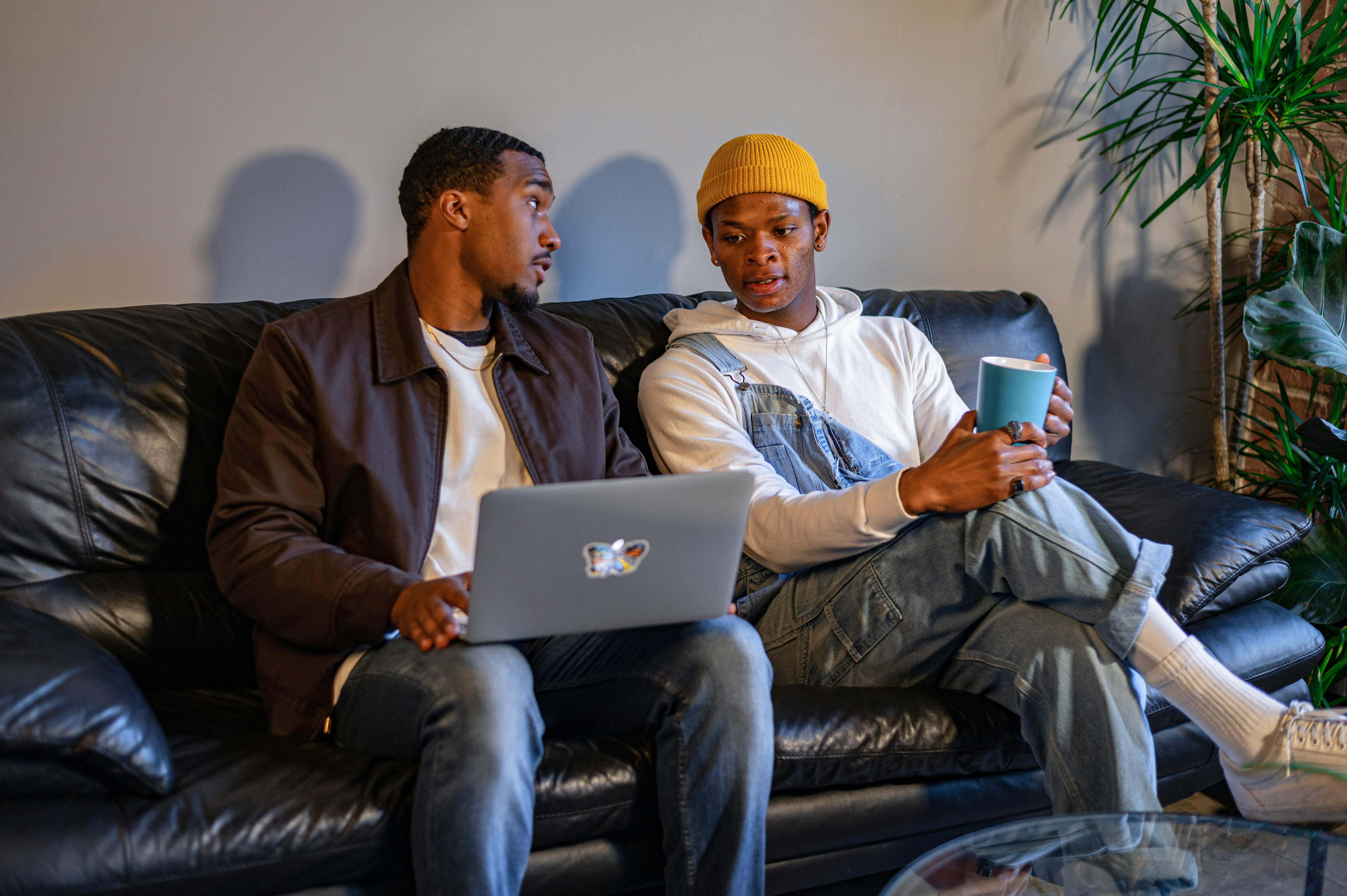 Men Having a Conversation While Sitting on a Couch · Free Stock Photo