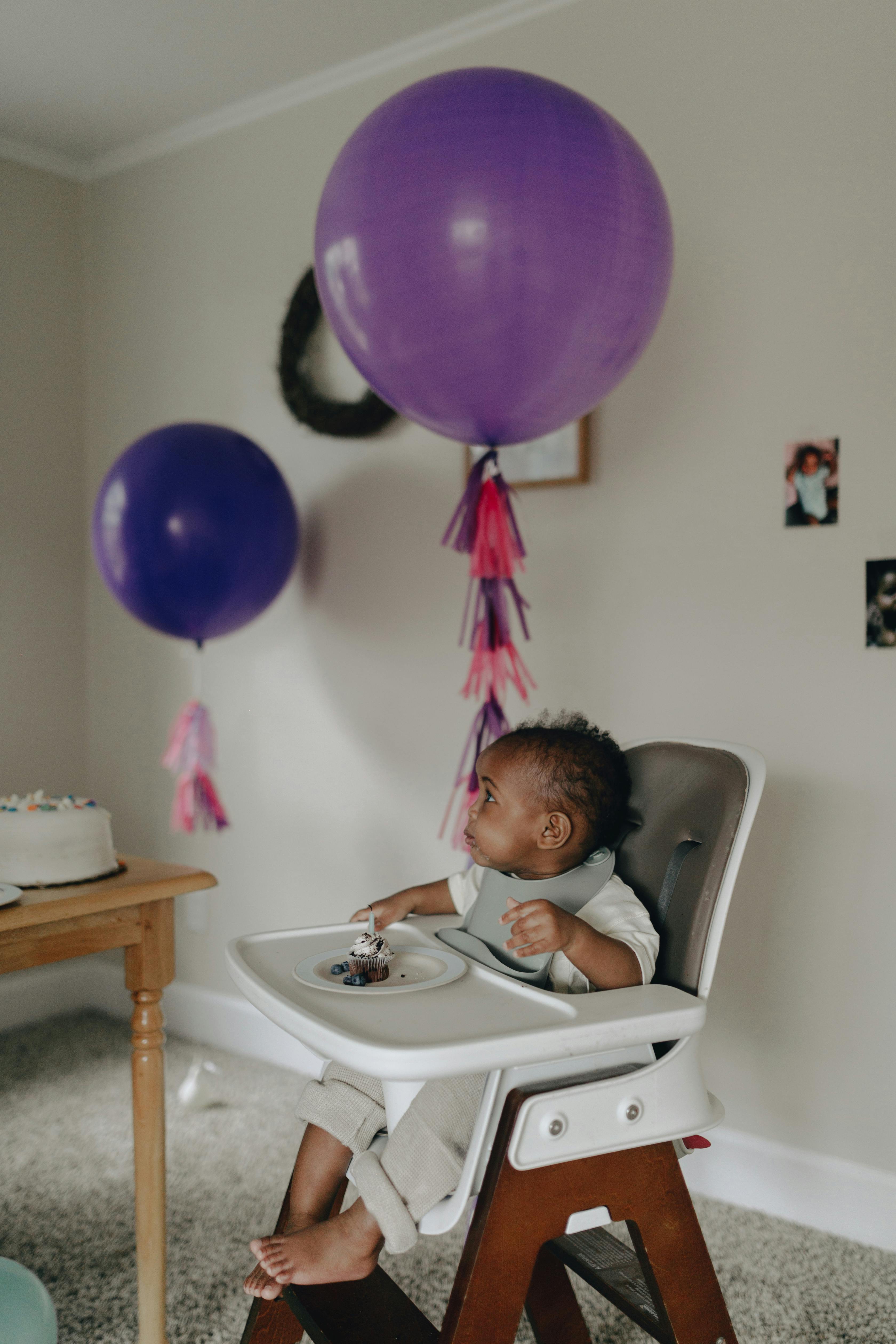 Child Sitting on High Chair · Free Stock Photo
