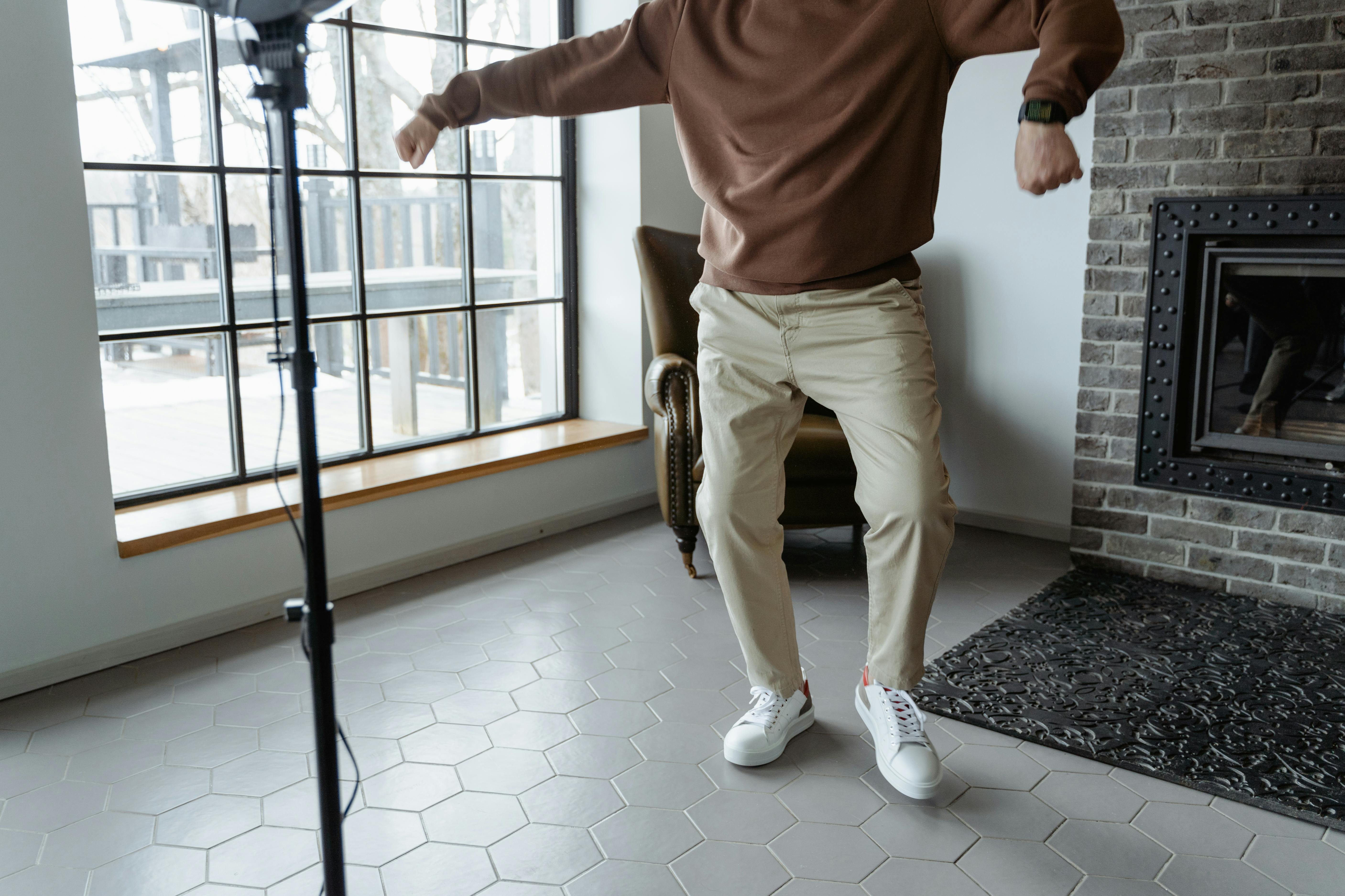 Man in Brown Sweater Dancing · Free Stock Photo