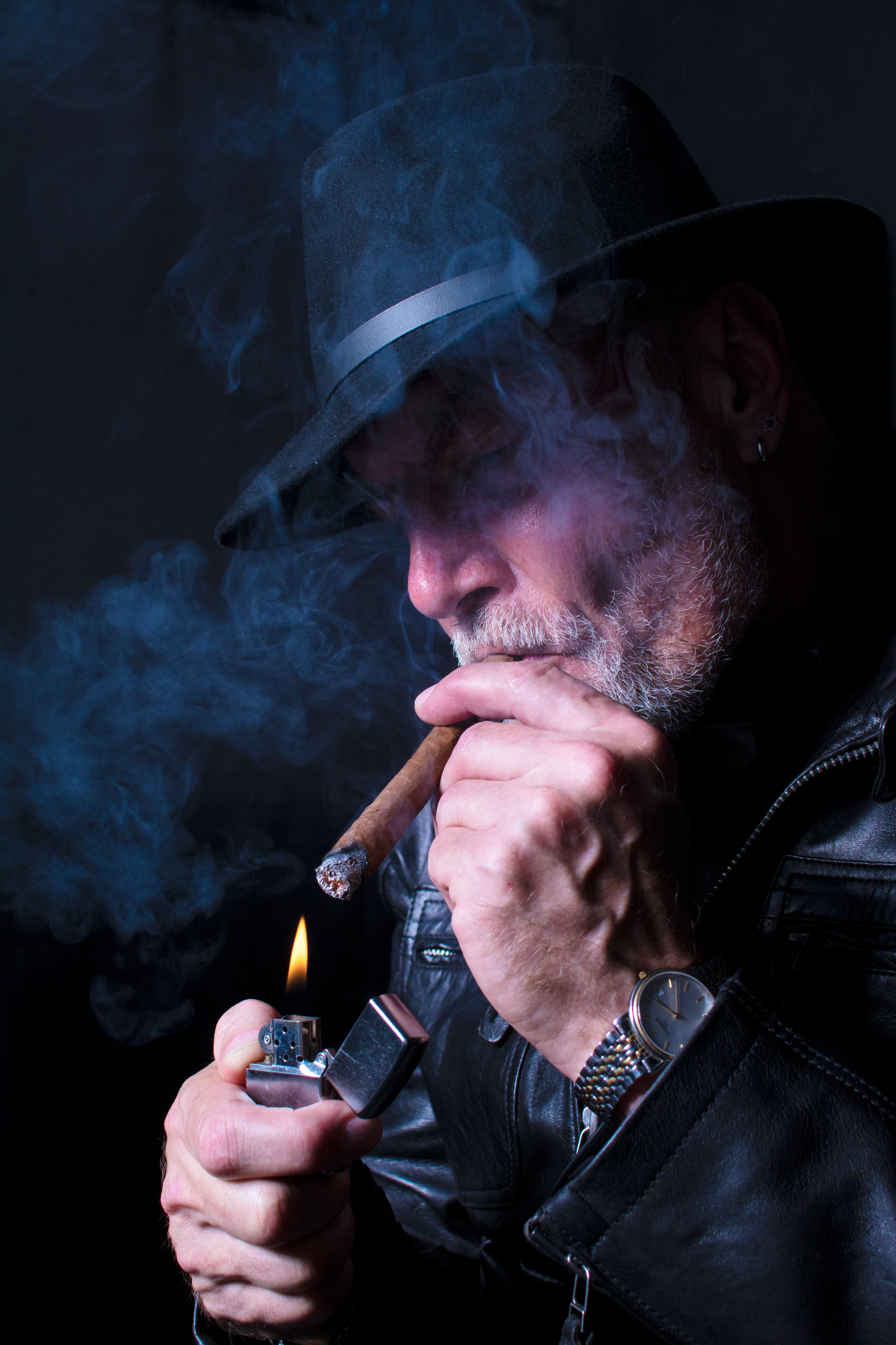 A Bearded Man Smoking a Cigar · Free Stock Photo