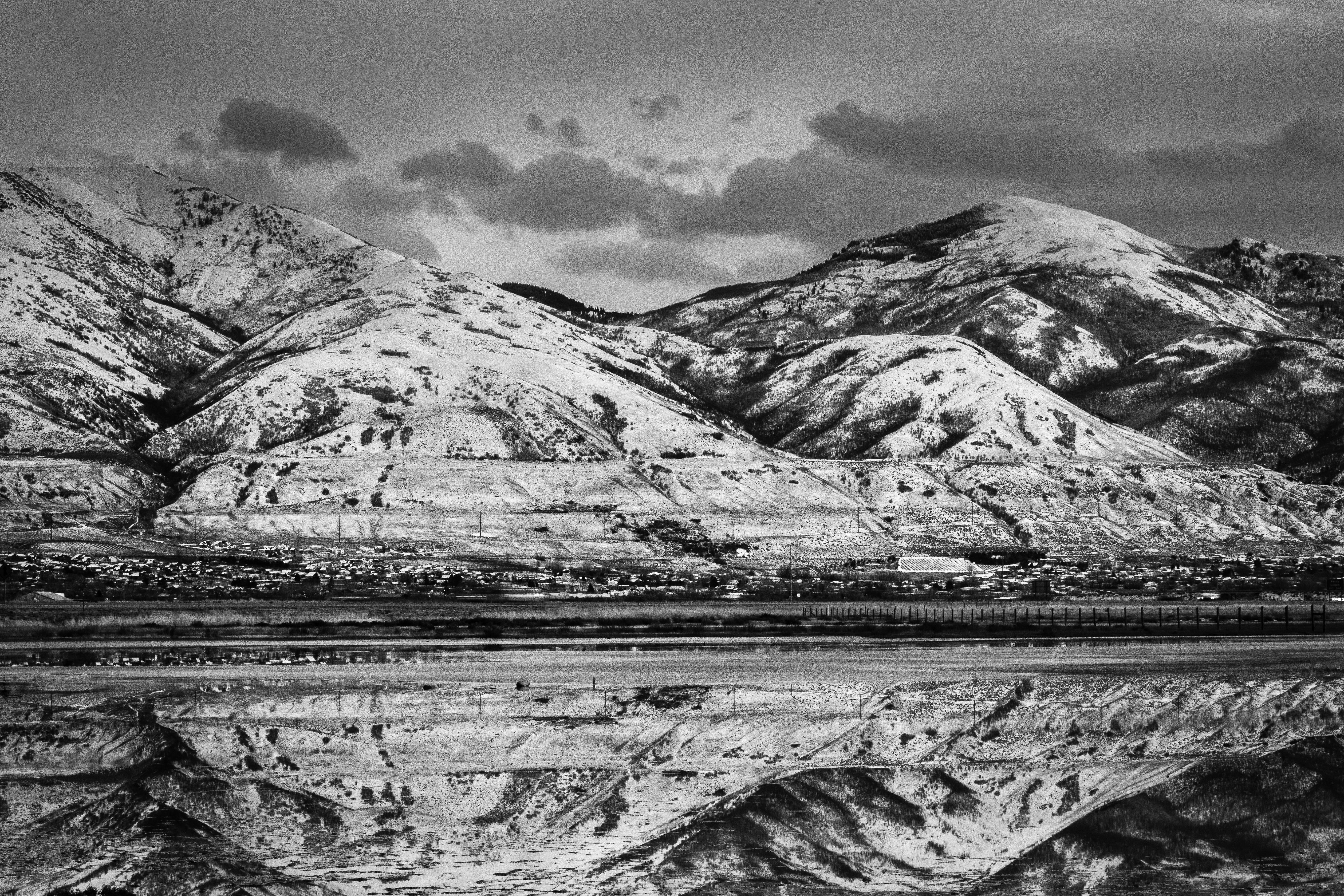 Grayscale Photo of a Landscape View of Mountains · Free Stock Photo
