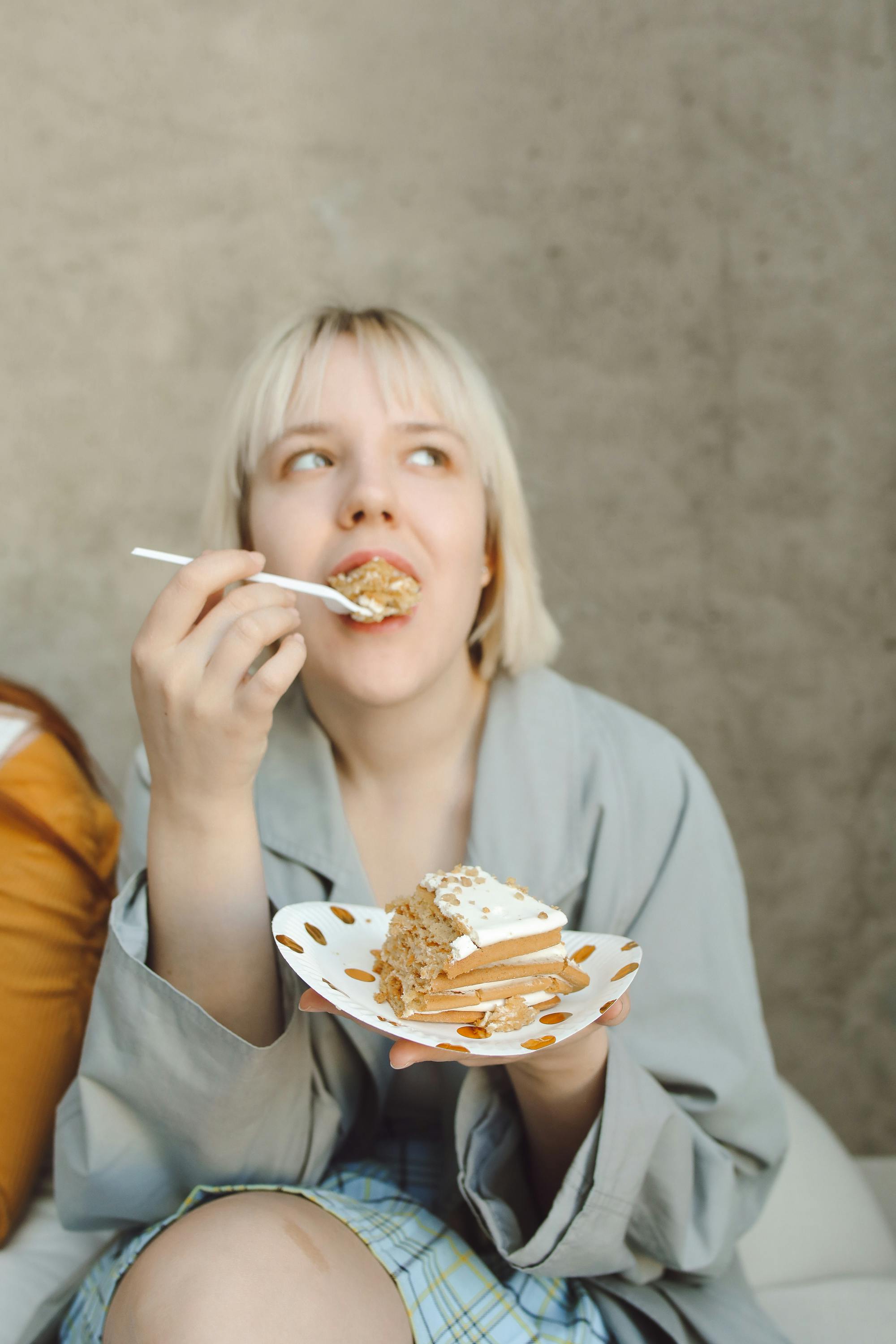 Close-Up Shot of a Person Eating Cake · Free Stock Photo