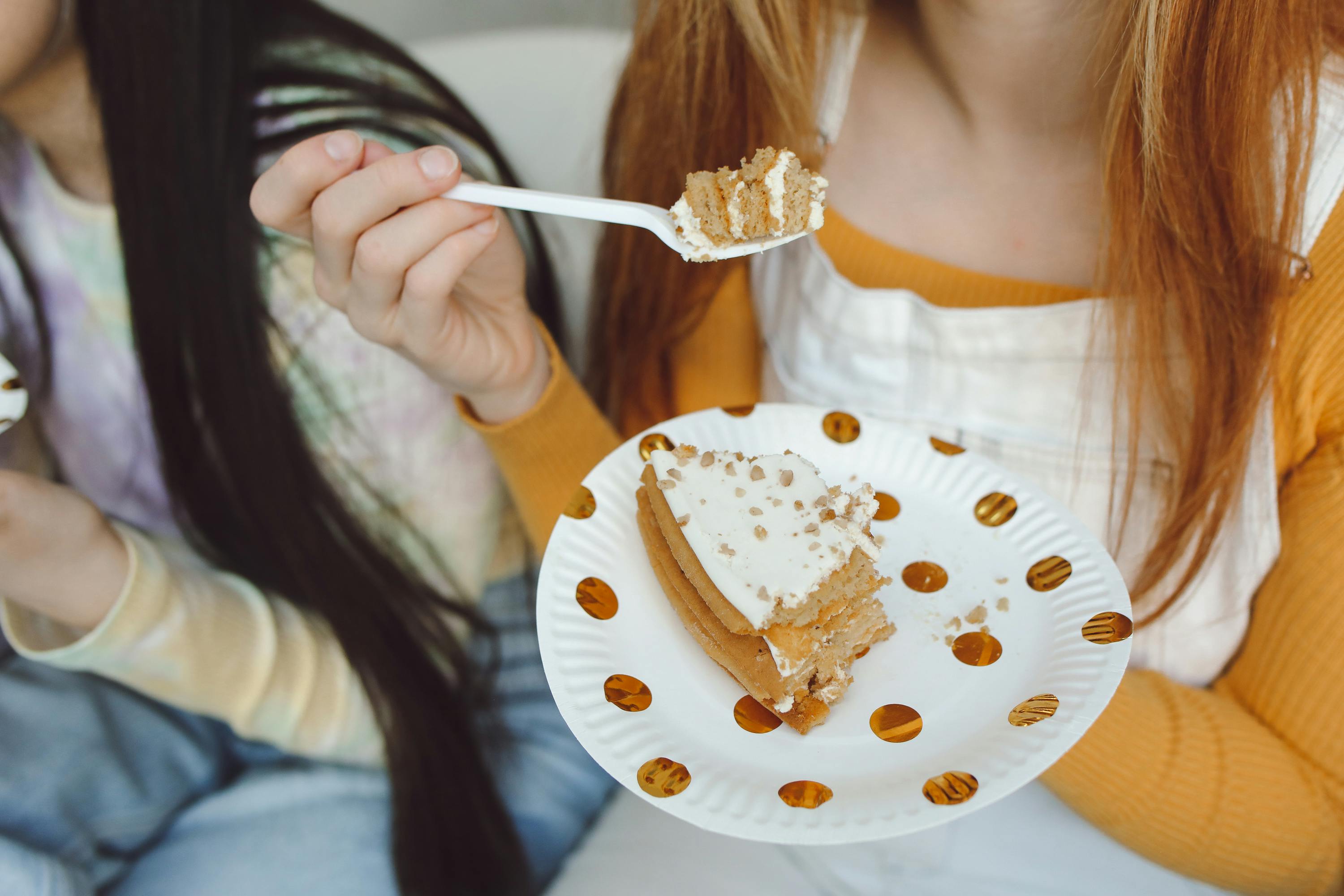 Close-Up Shot of a Person Eating Cake · Free Stock Photo