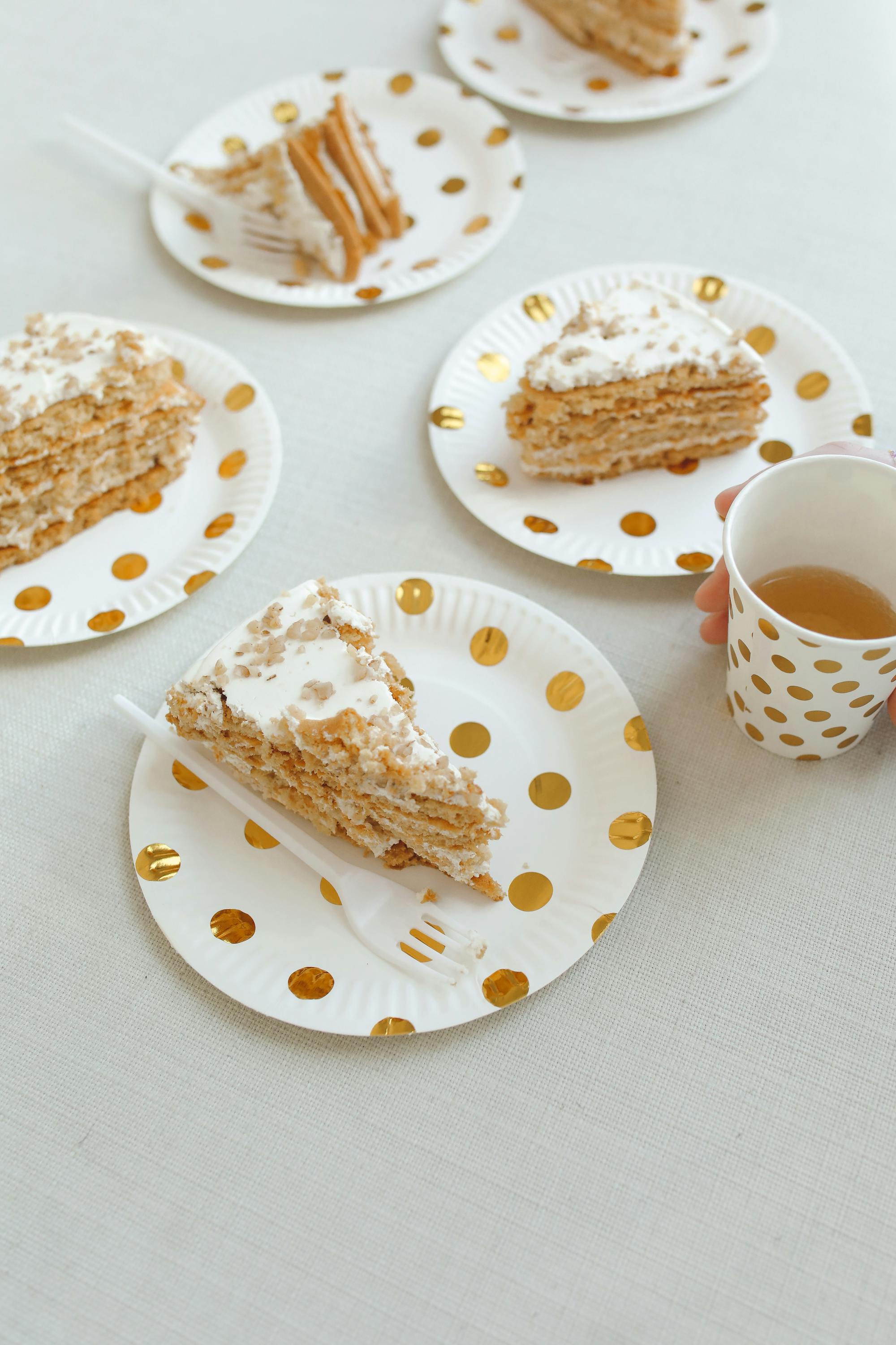 Plates with Birthday Cake on Table · Free Stock Photo