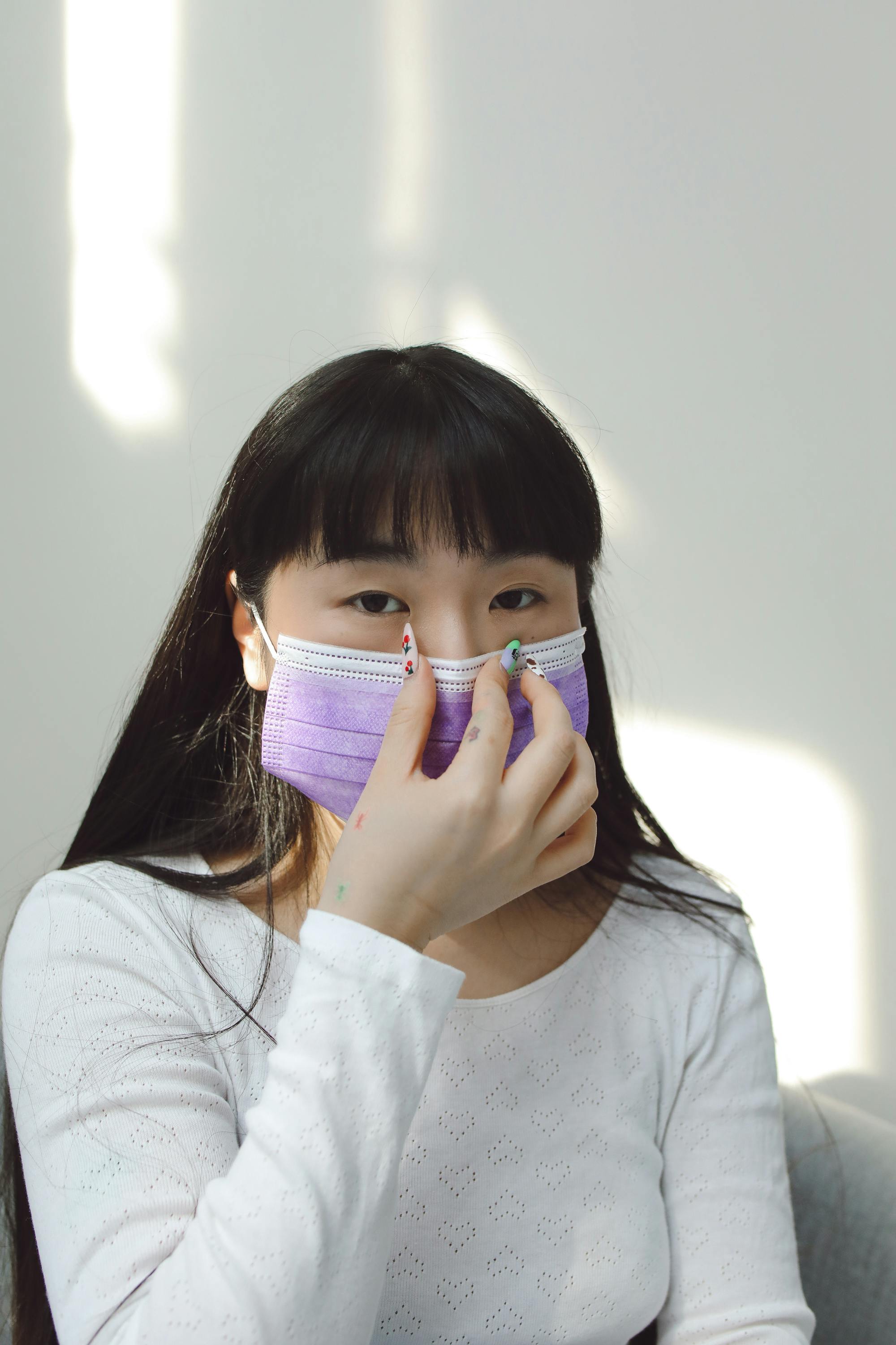 A Woman with Bangs Wearing a Face Mask · Free Stock Photo