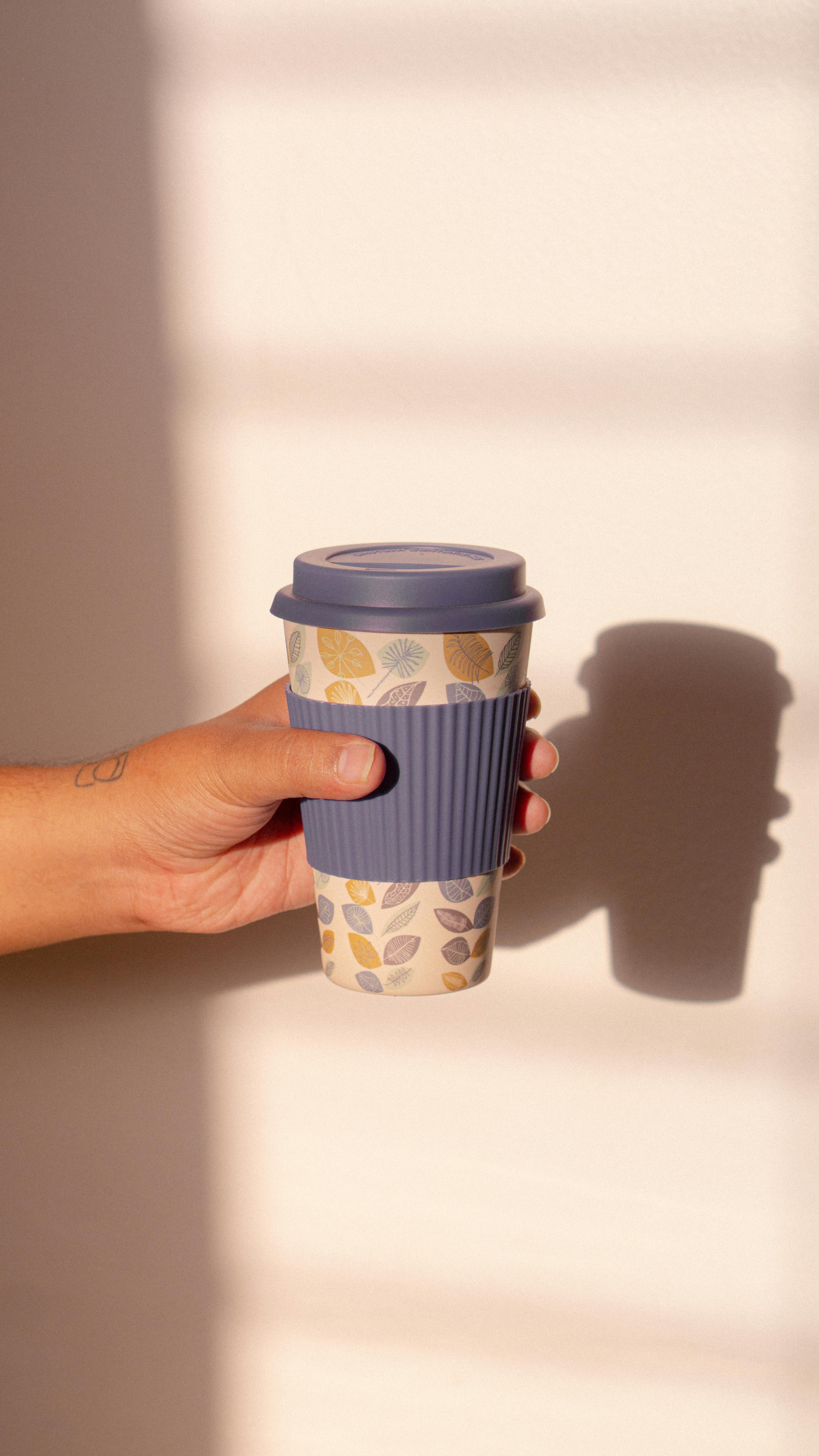 Person Holding a Paper Cup · Free Stock Photo
