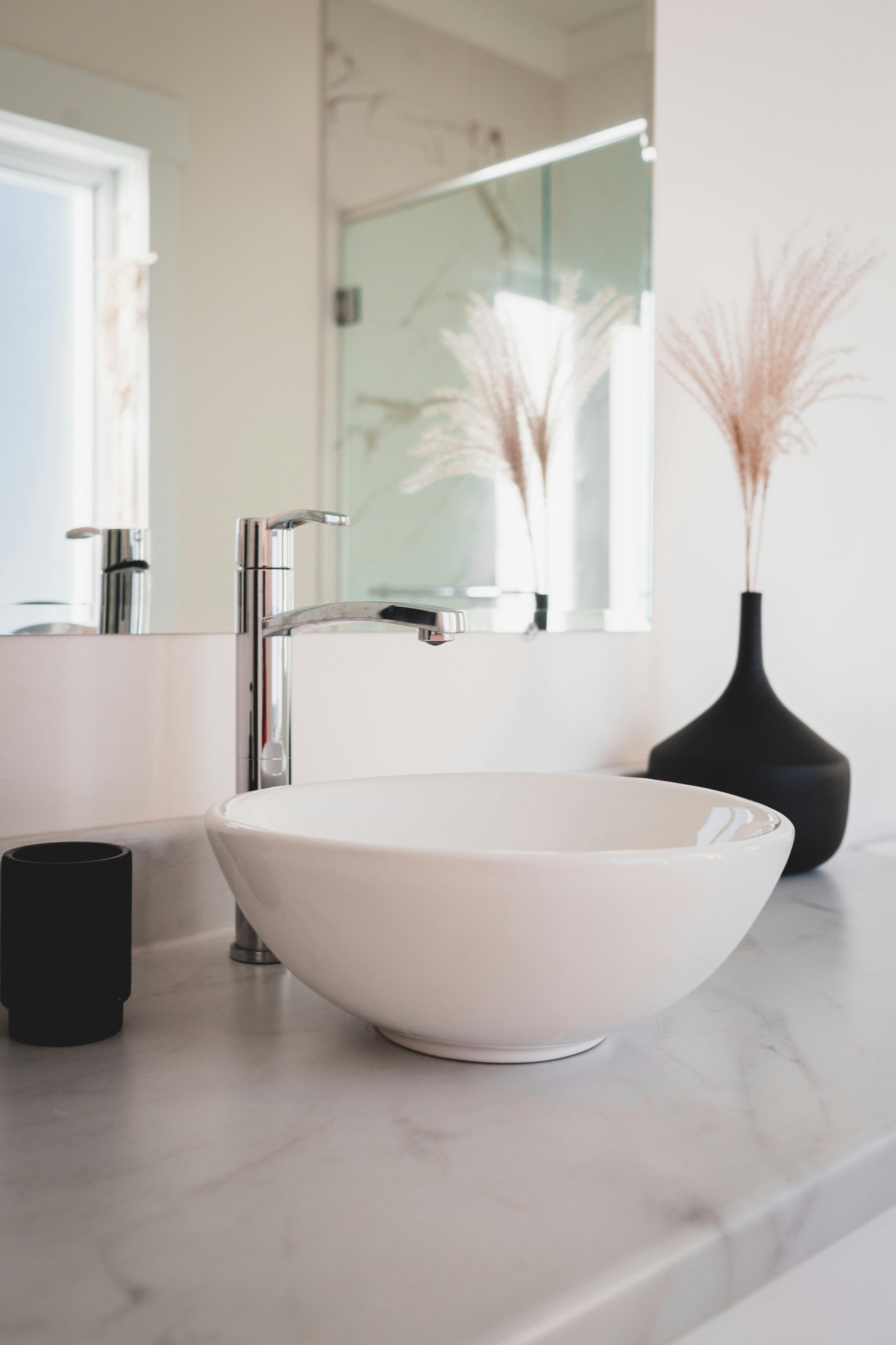 Pink sink in bathroom near wall · Free Stock Photo
