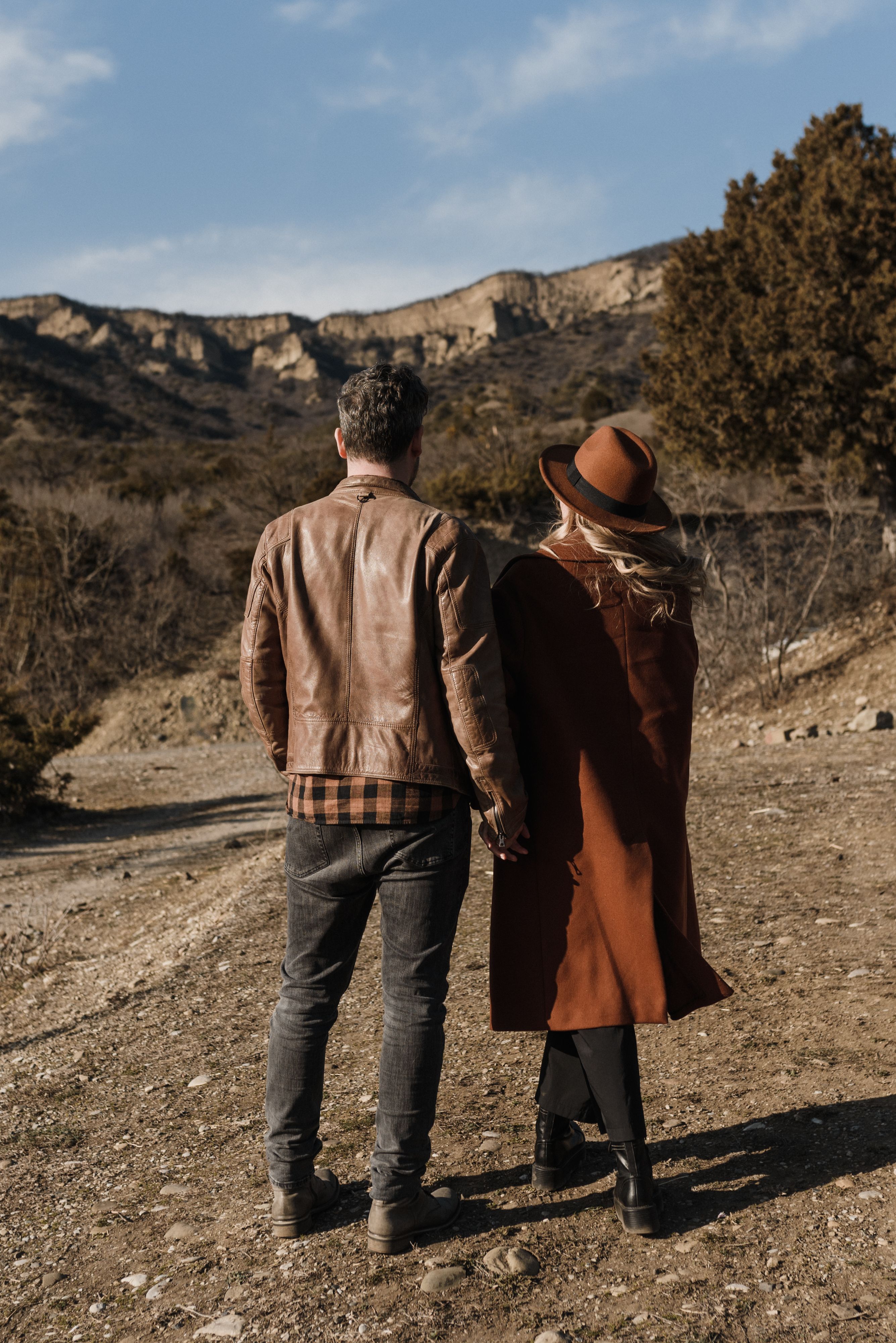 Back View of a Couple Holding Hands · Free Stock Photo