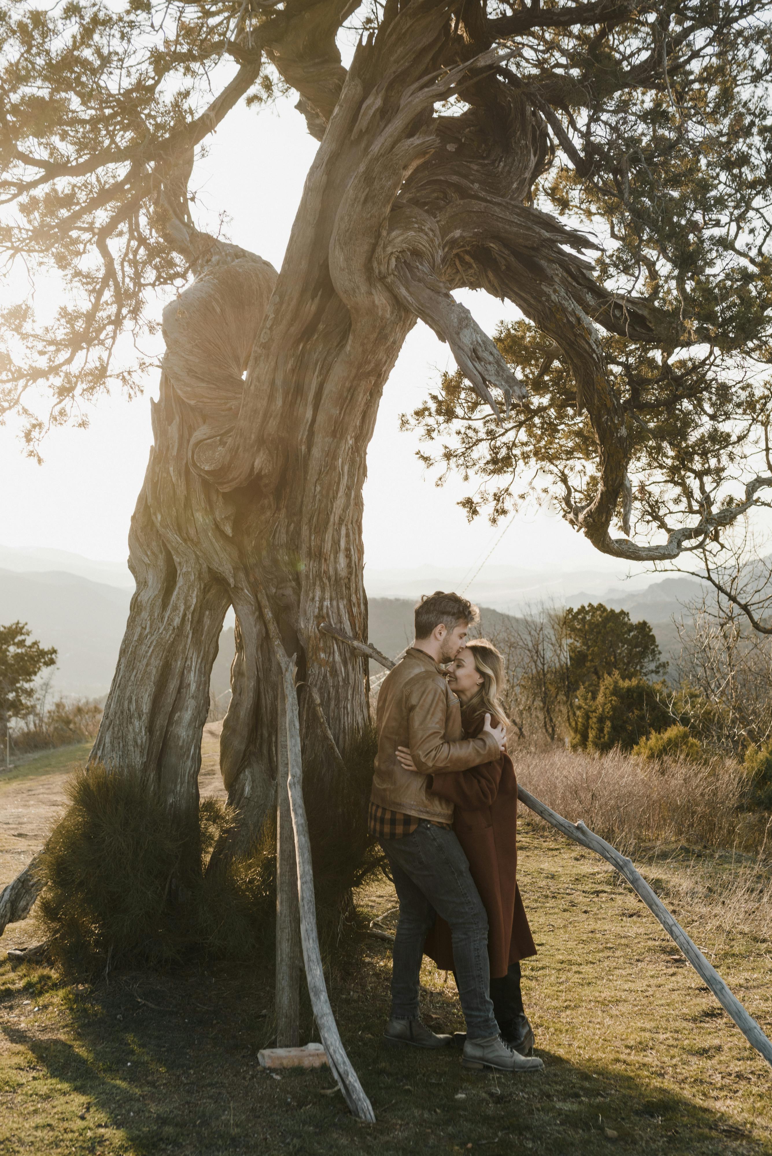 Couple Standing near a Tree · Free Stock Photo