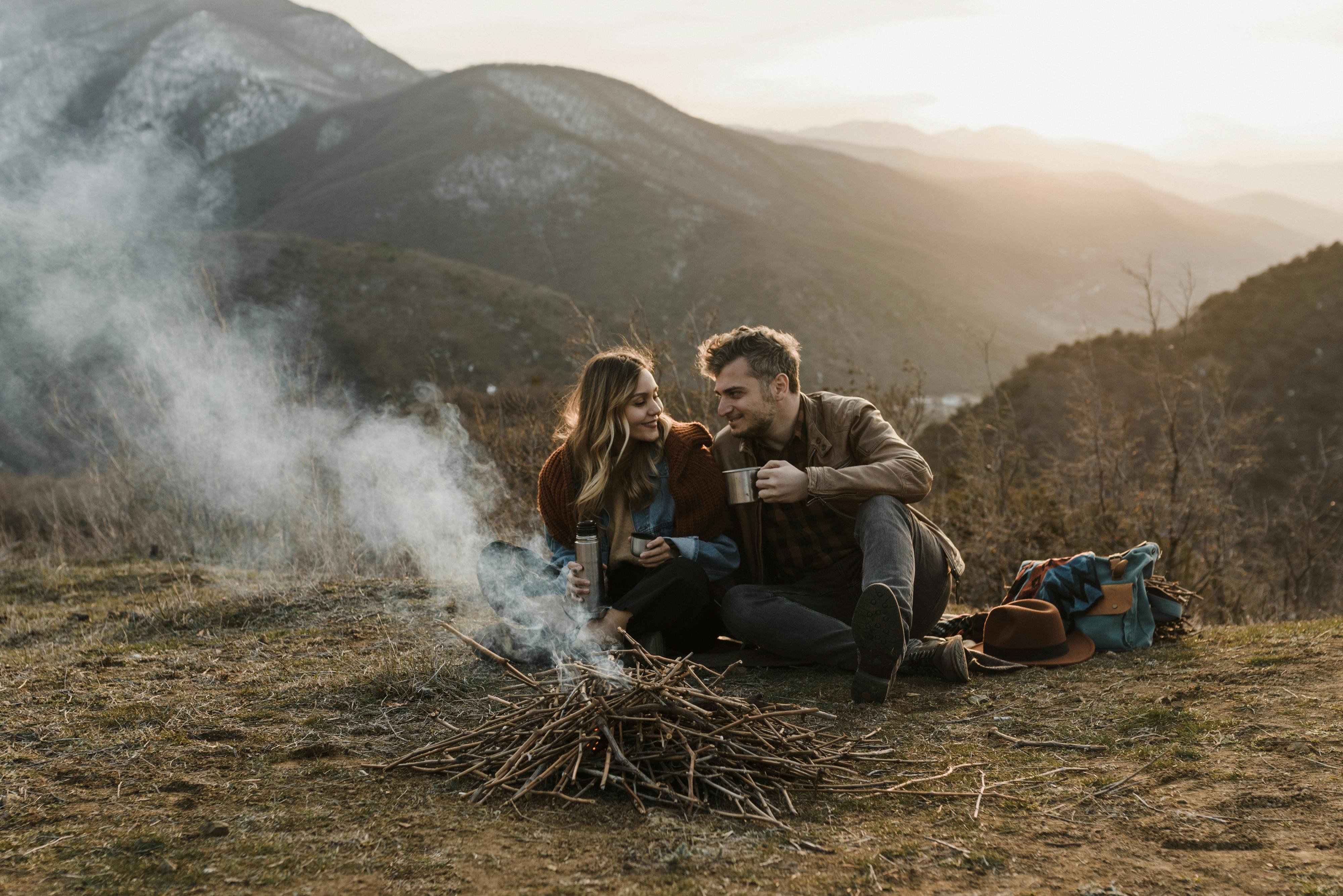 Couple Having a Bonfire on the Top of a Hill · Free Stock Photo