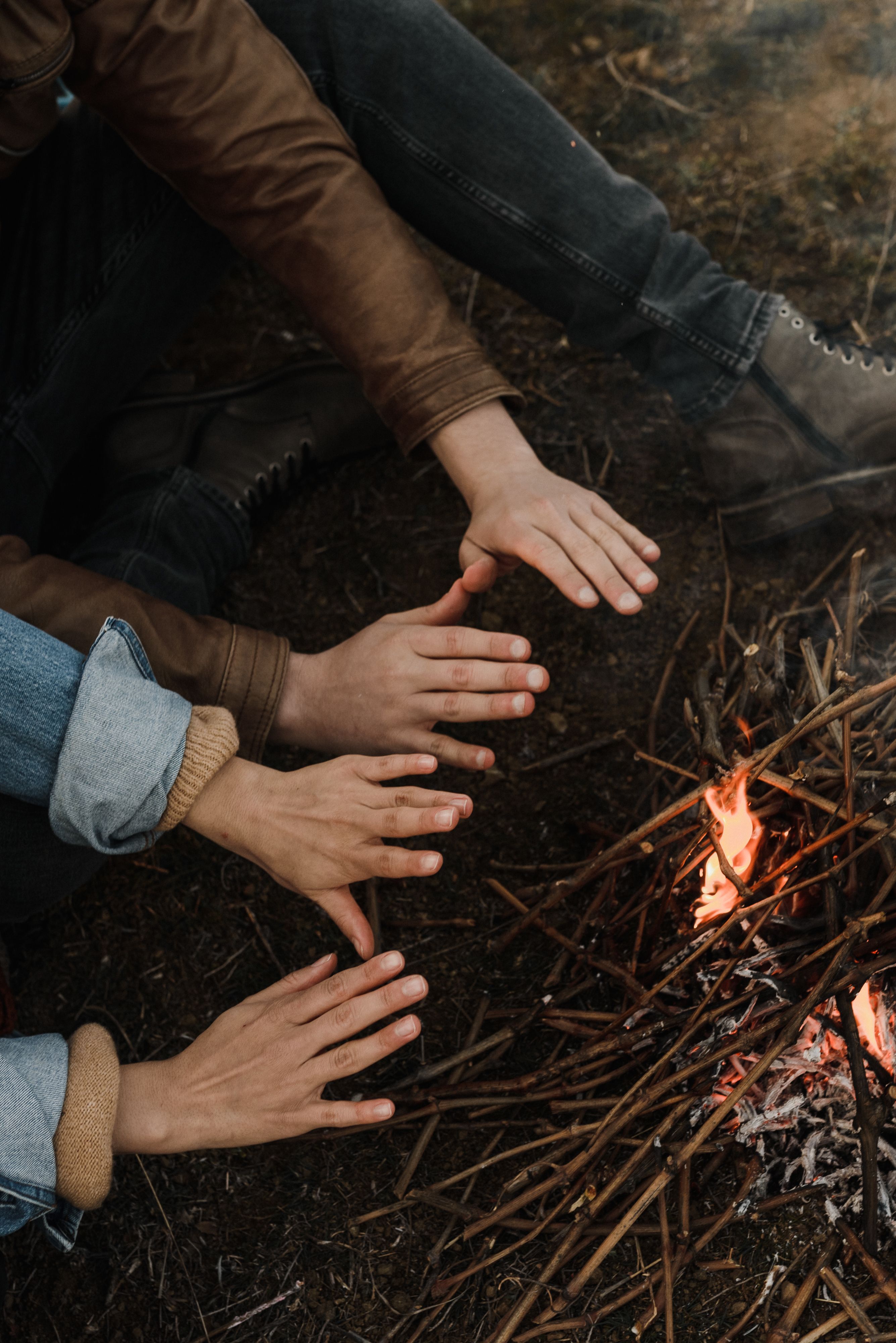 Hands Warming Over Fire · Free Stock Photo