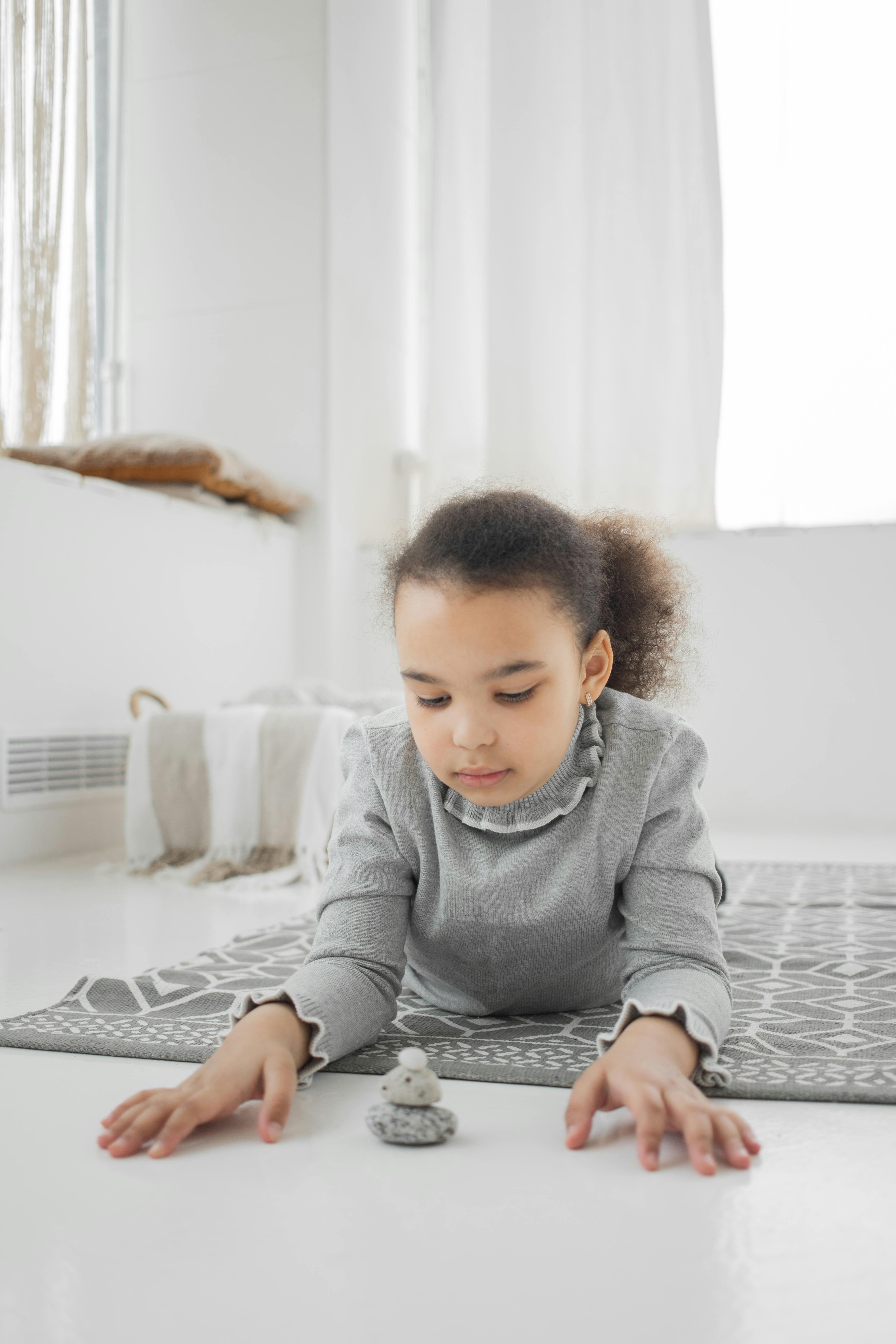 Curious African American child dipping finger into water · Free Stock Photo