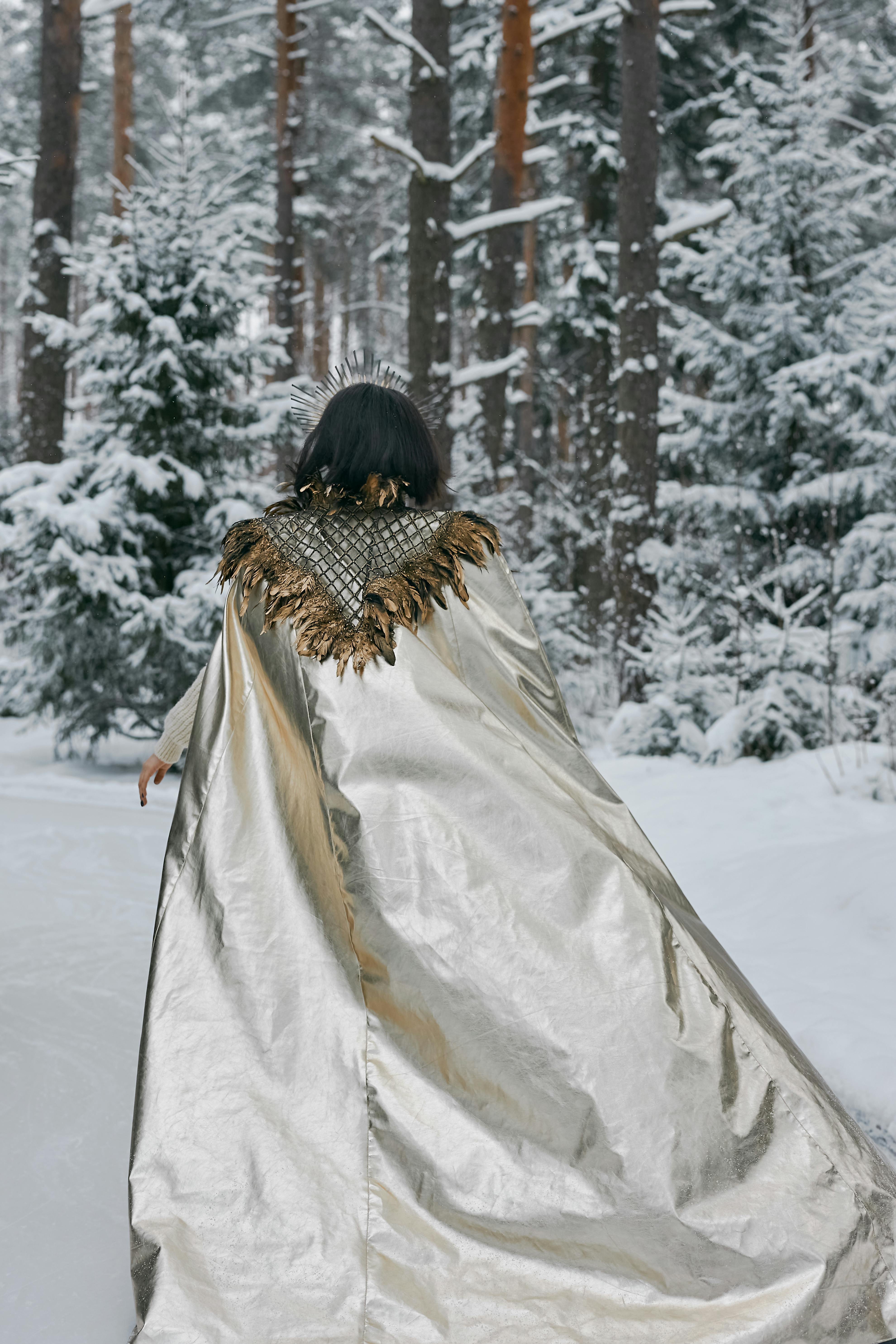 Back View of a Person Wearing a Cape with Japanese Writing Walking in a ...