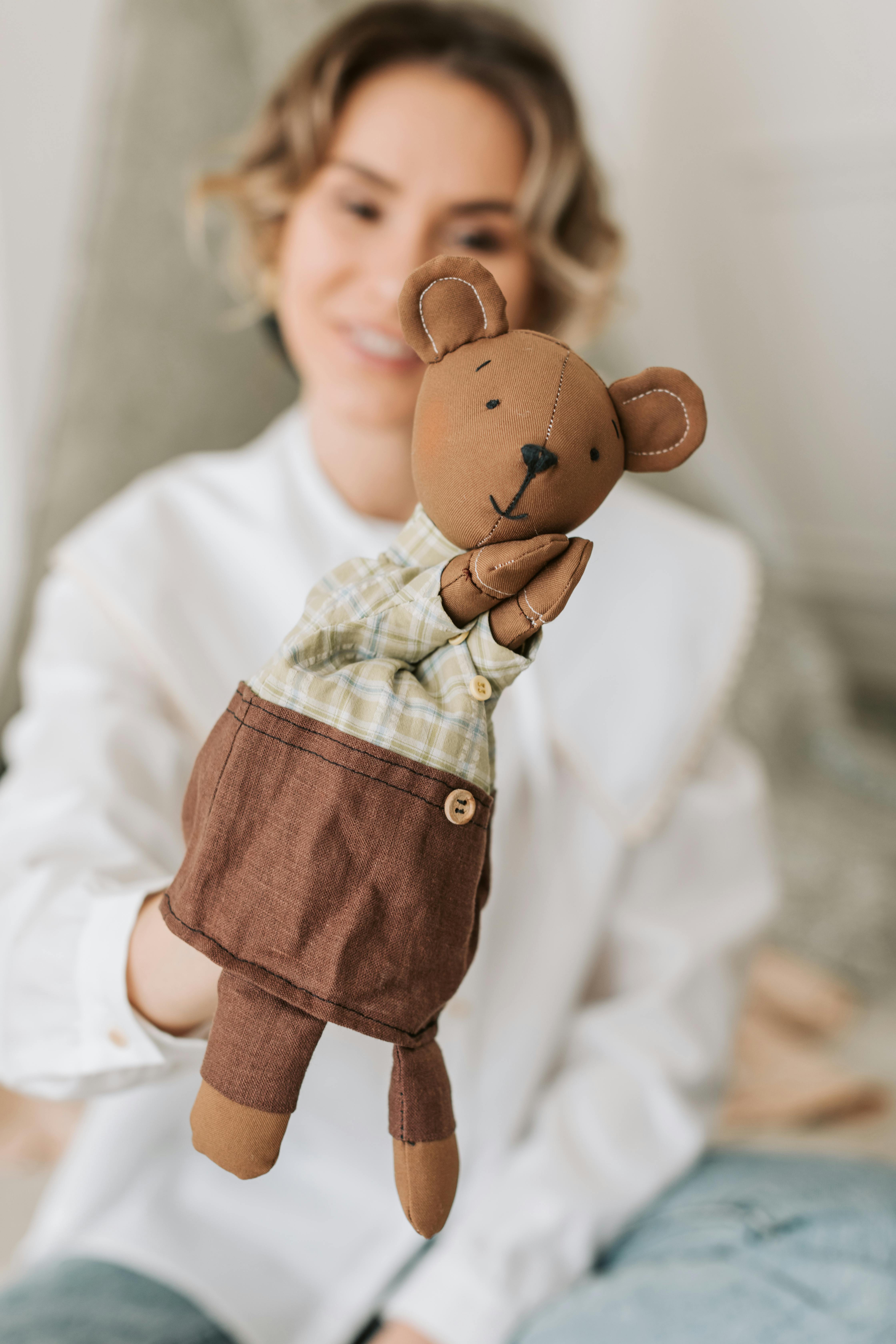 Woman Holding a Hand Puppet · Free Stock Photo
