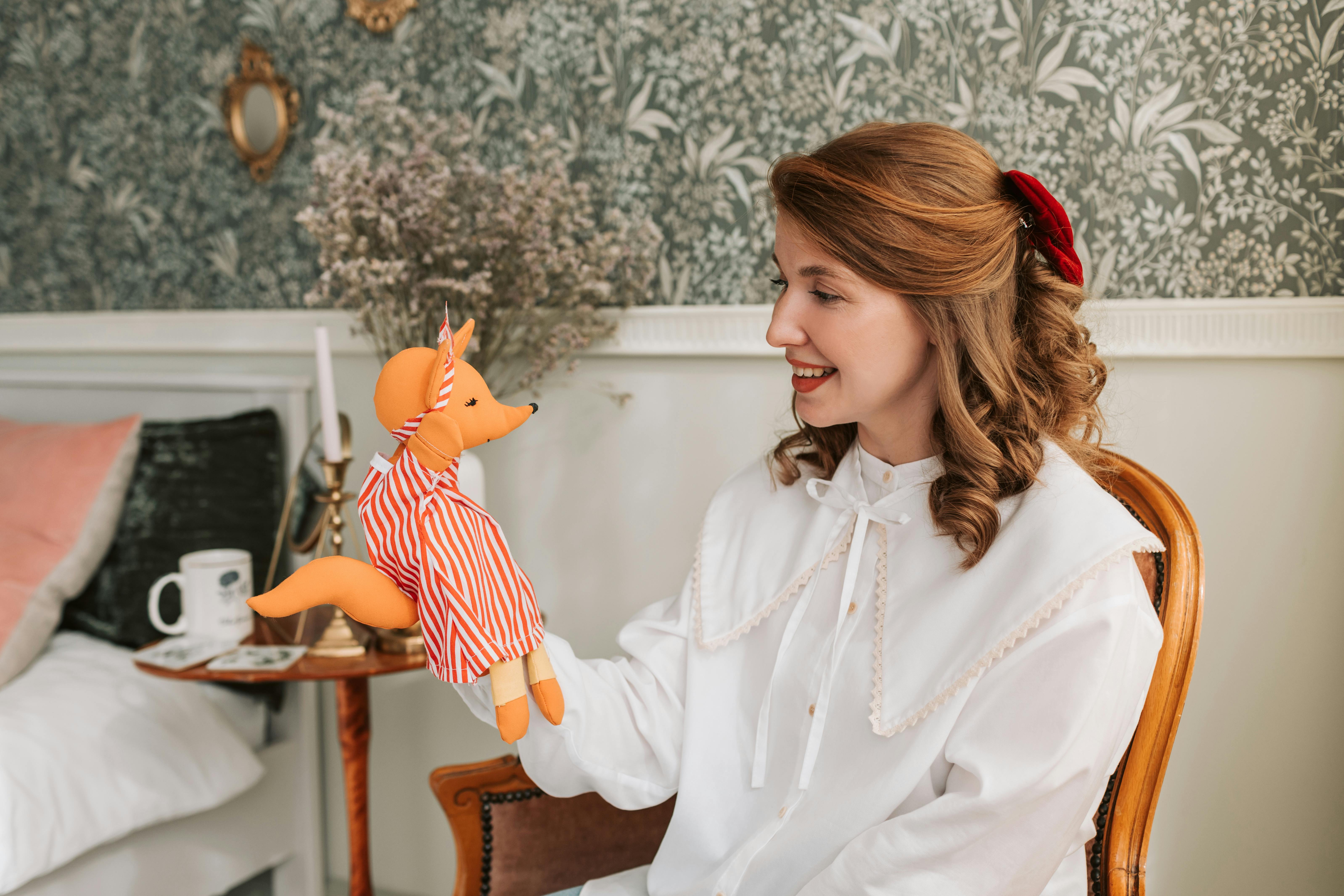 Woman Looking at a Hand Puppet · Free Stock Photo