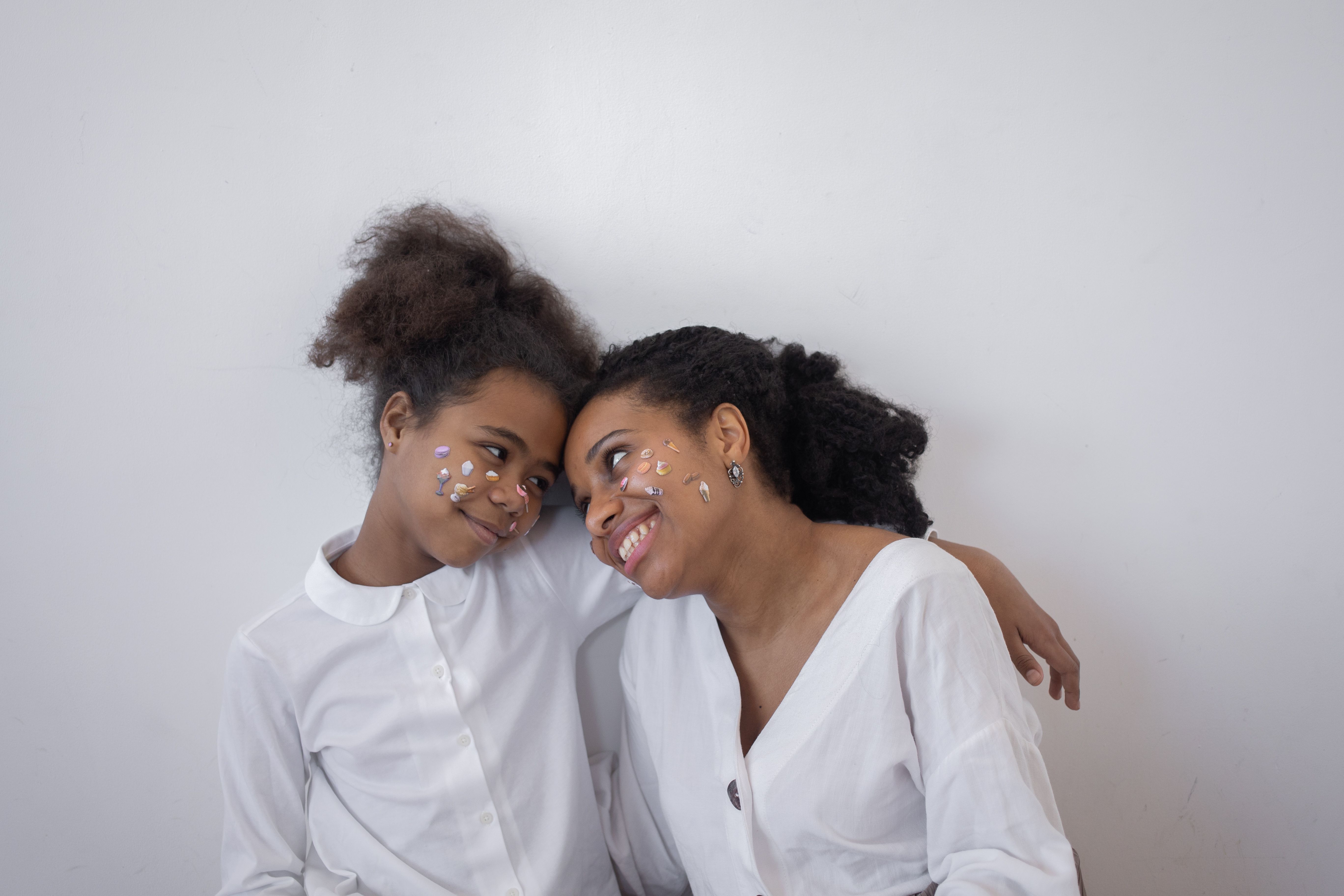 Mother and Daughter with Face Stickers · Free Stock Photo