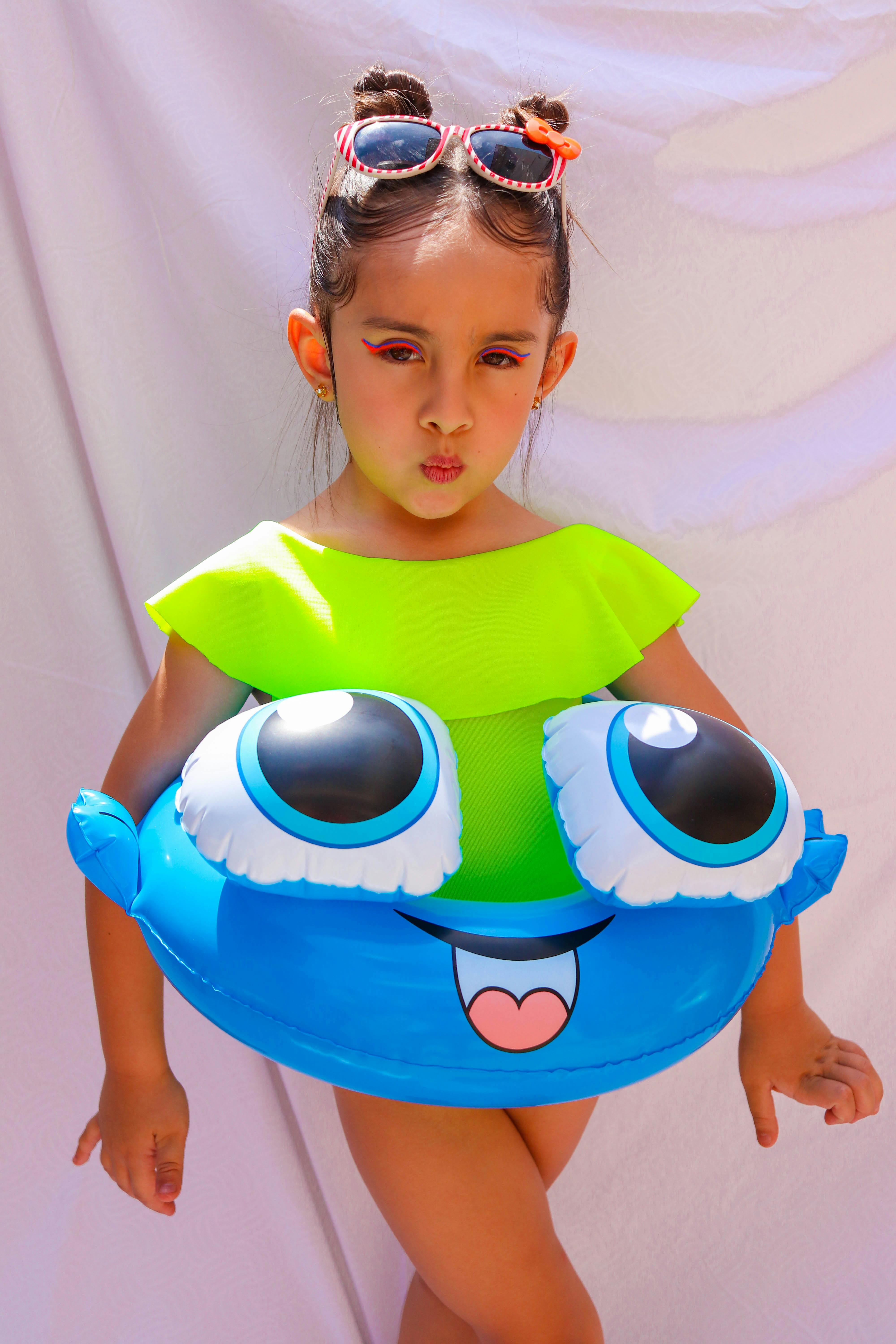 Cute Little Girl in Inflatable Pool Float · Free Stock Photo