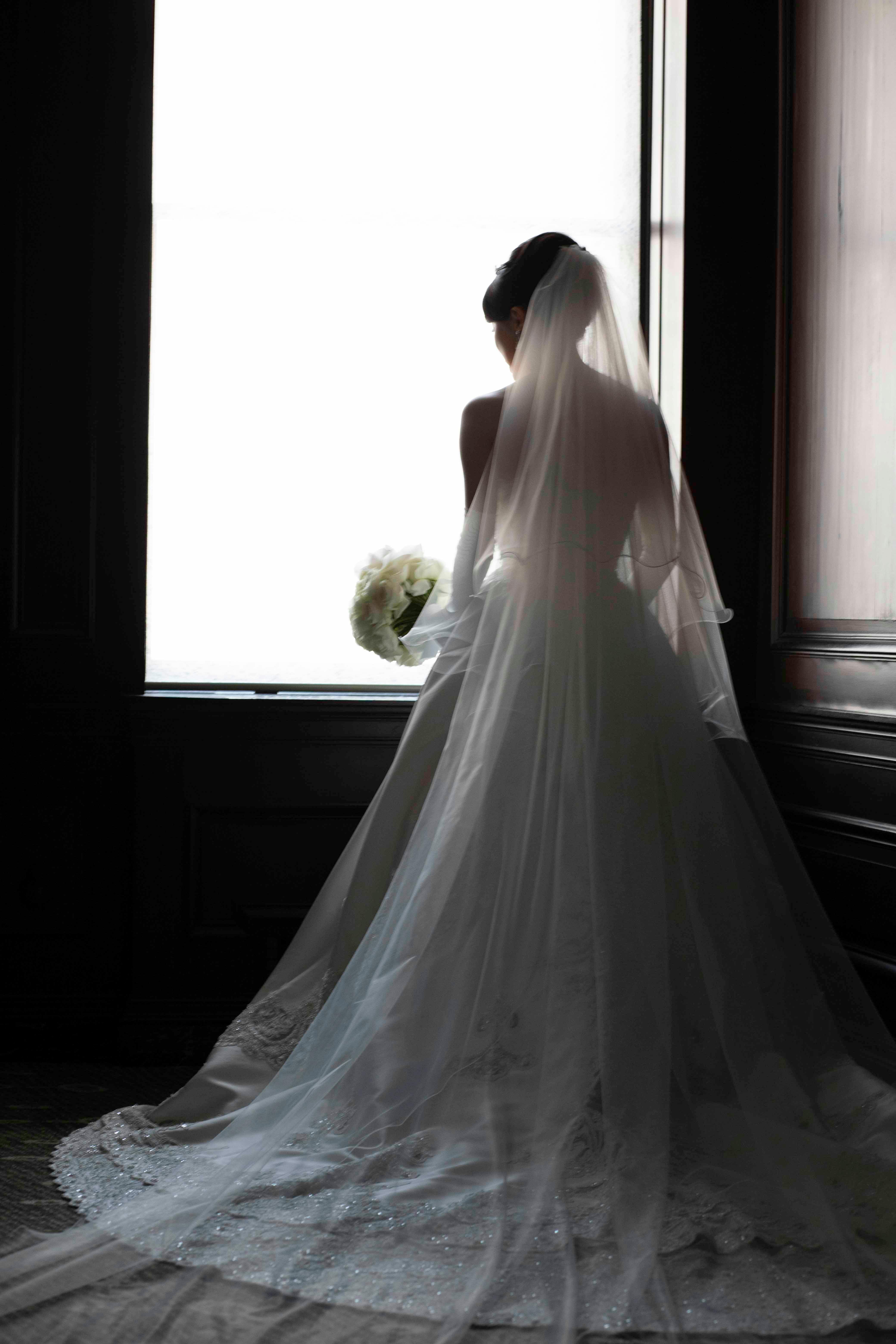 Back View of the Bride Standing Near the Window · Free Stock Photo