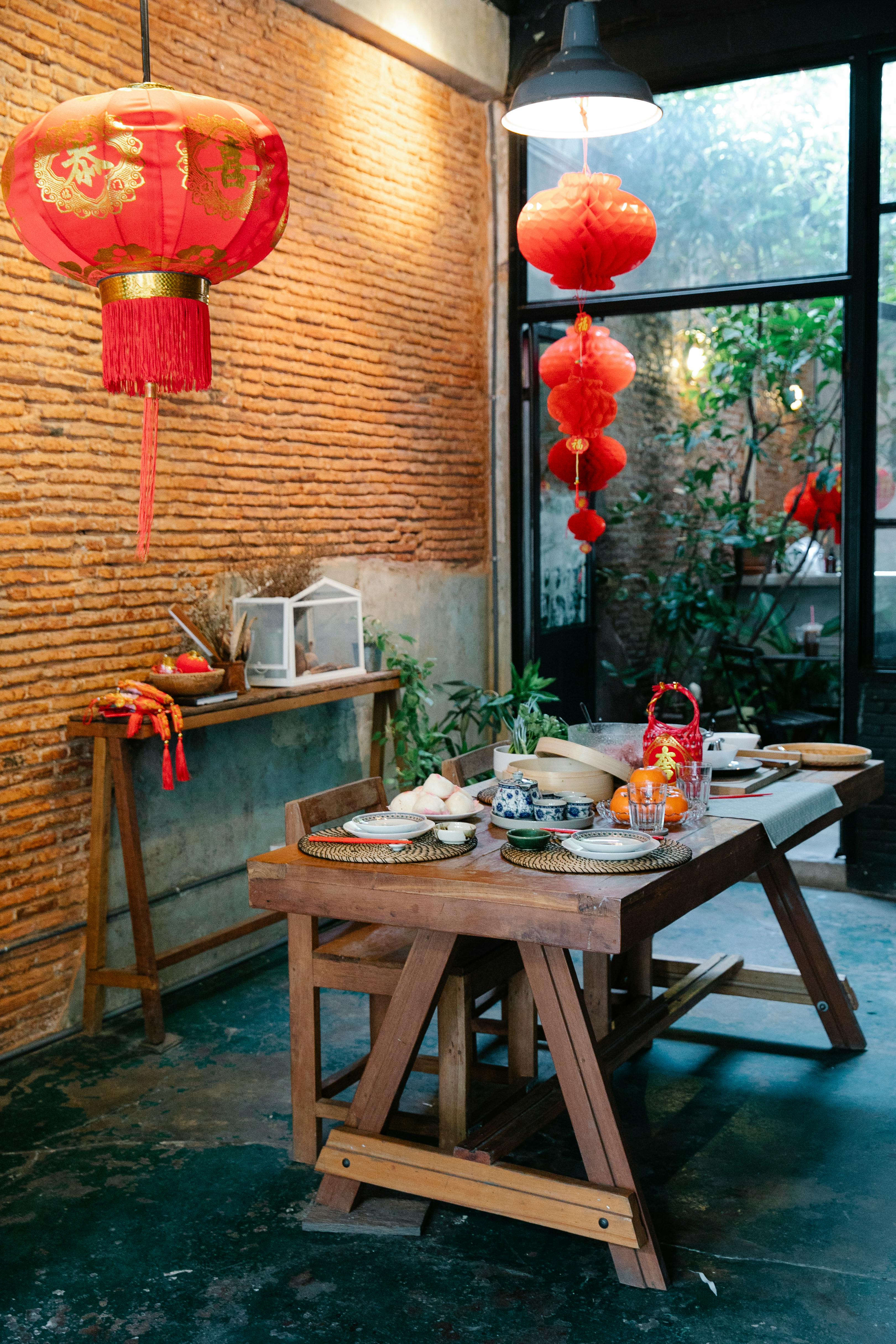 Wooden table served with traditional Asian food · Free Stock Photo