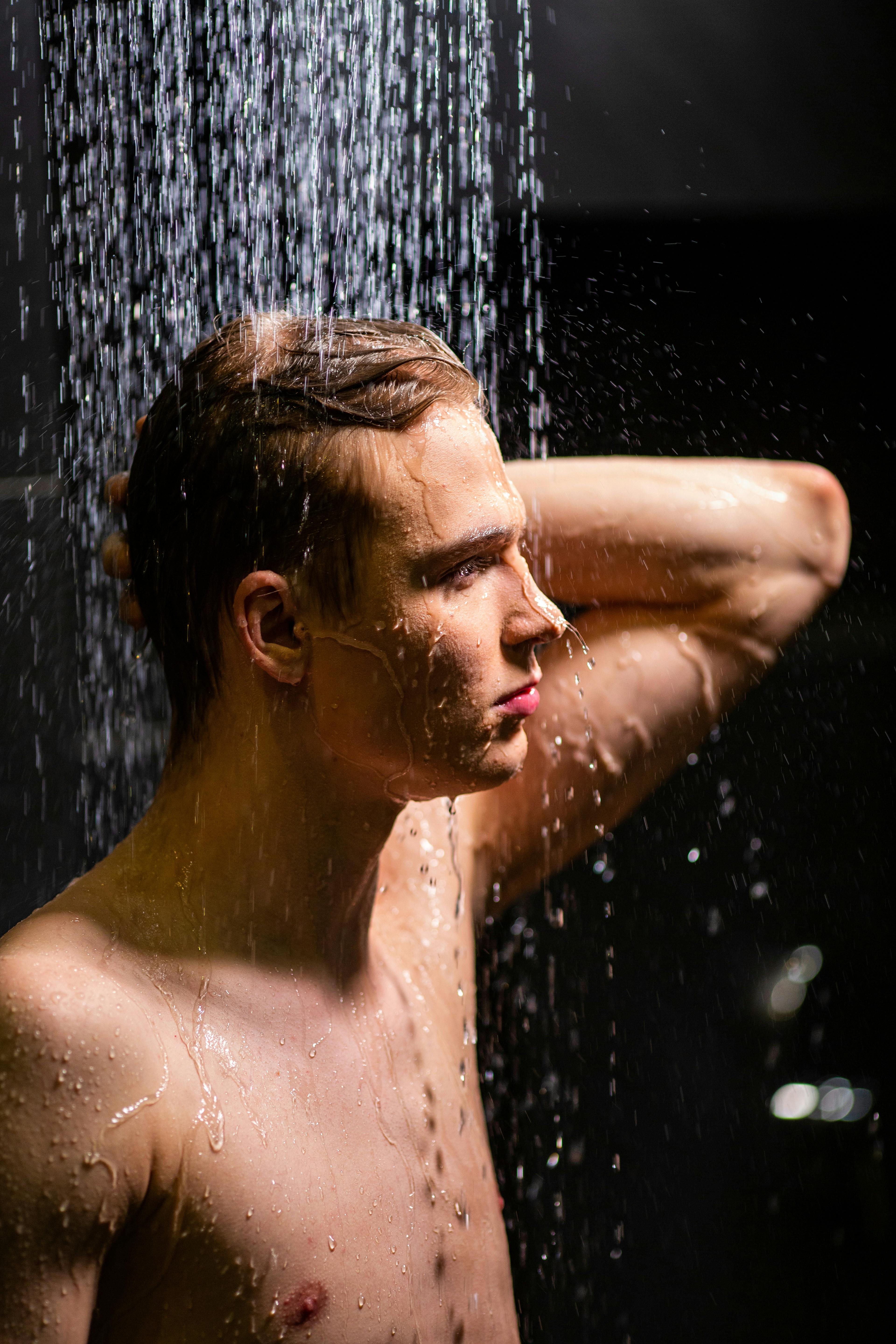 A Man Taking a Shower · Free Stock Photo