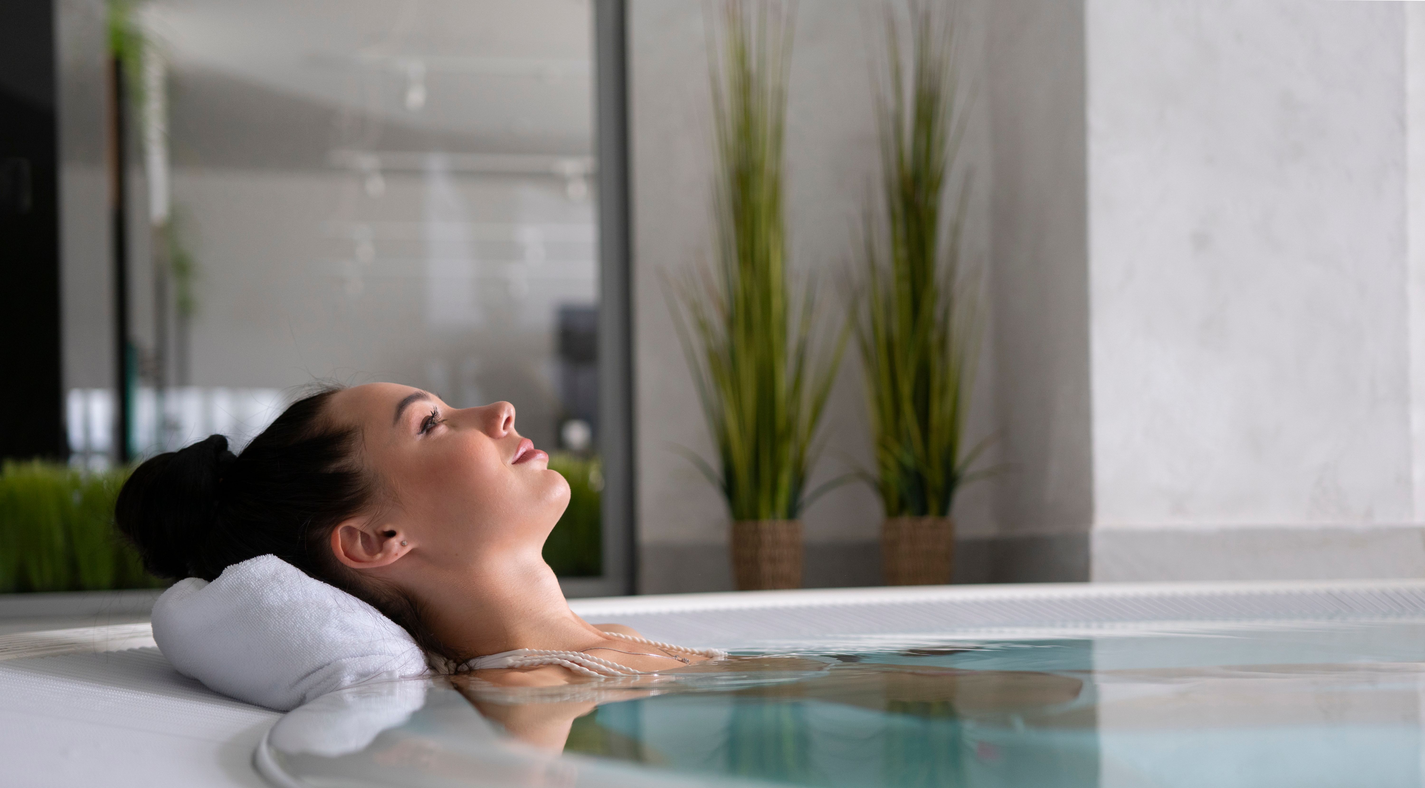Person Relaxing in a Jacuzzi · Free Stock Photo