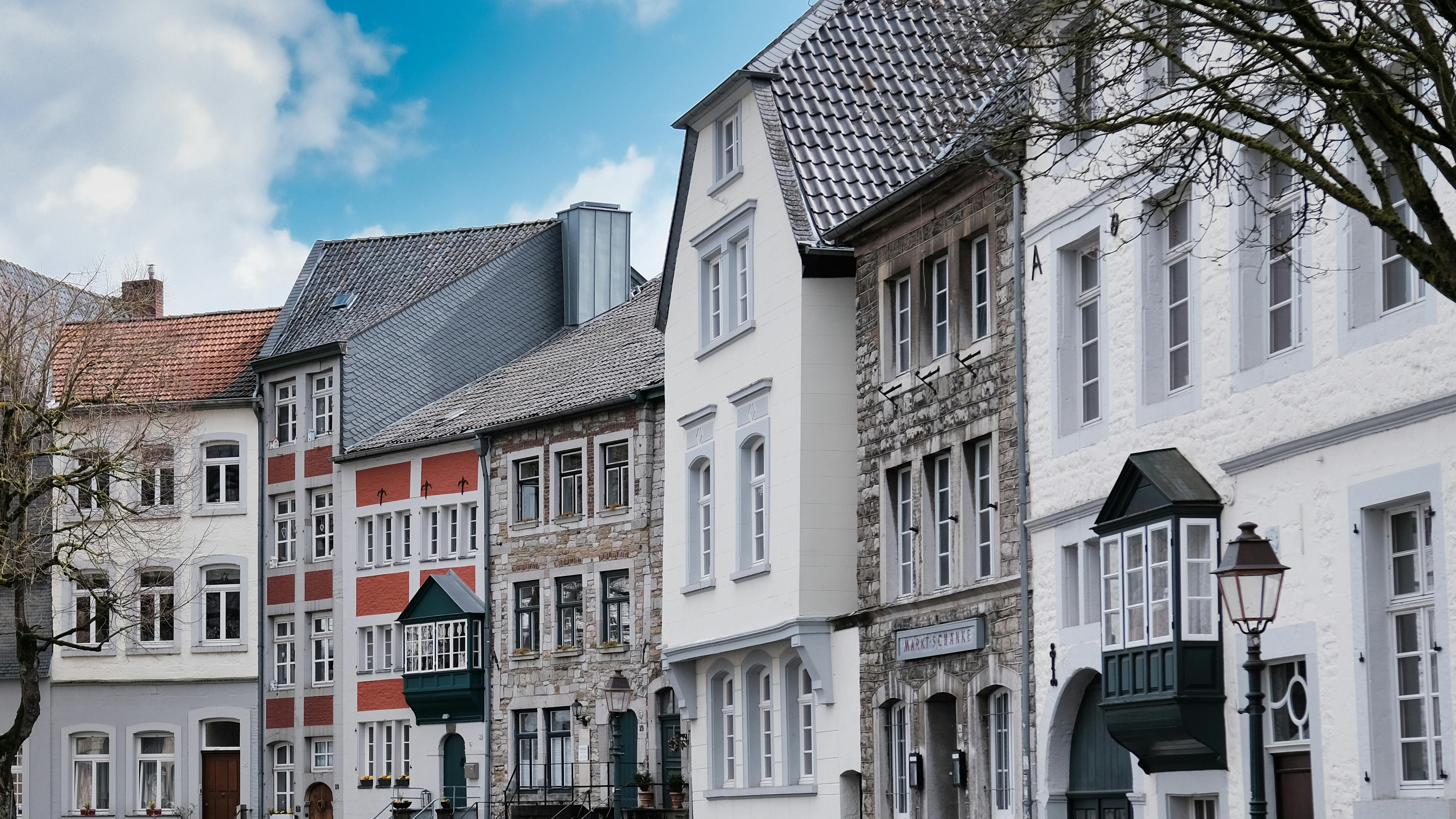 Grey Scale Photography of Concrete Building · Free Stock Photo