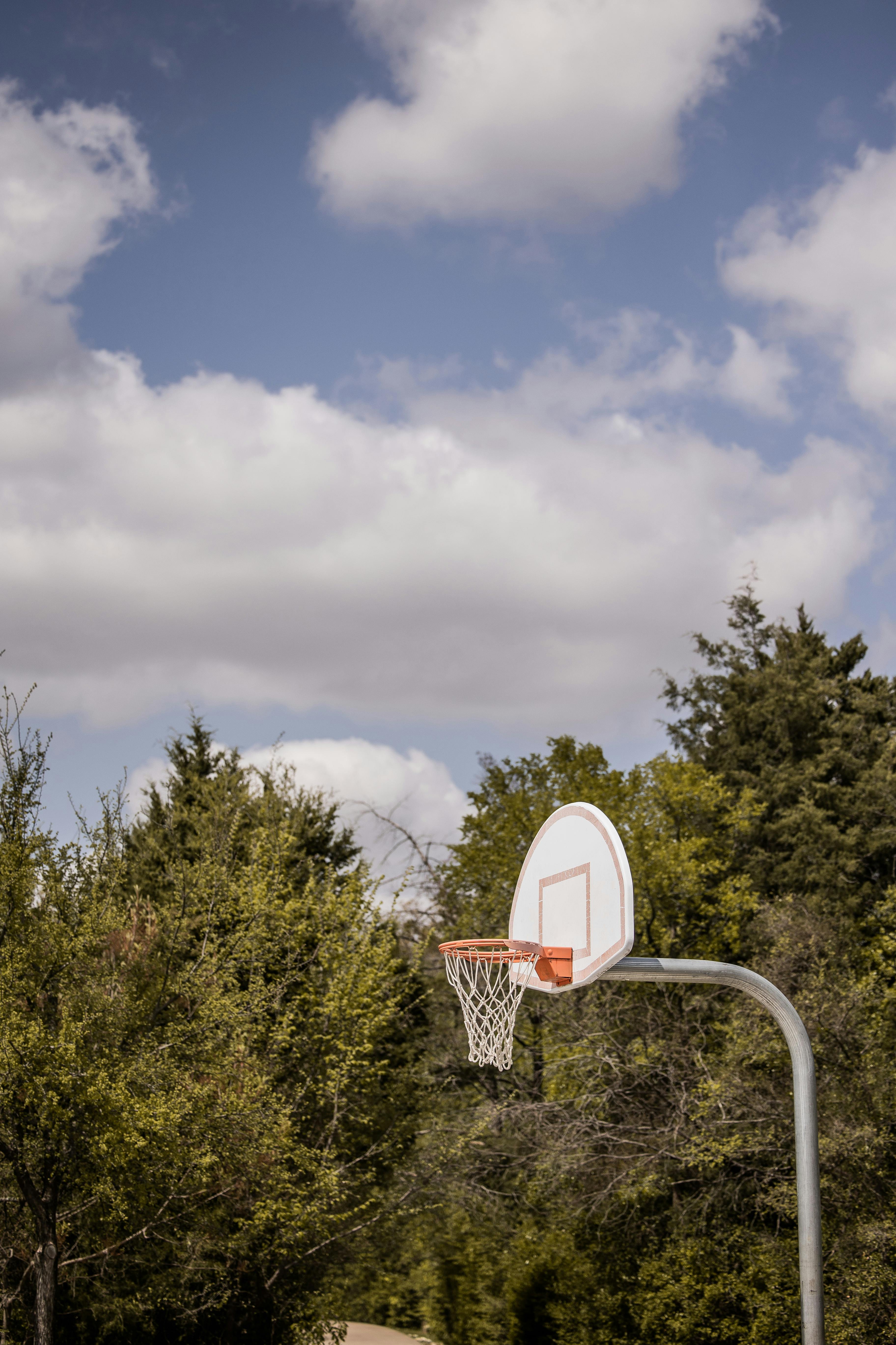 Shadow of basketball hoop on wall · Free Stock Photo
