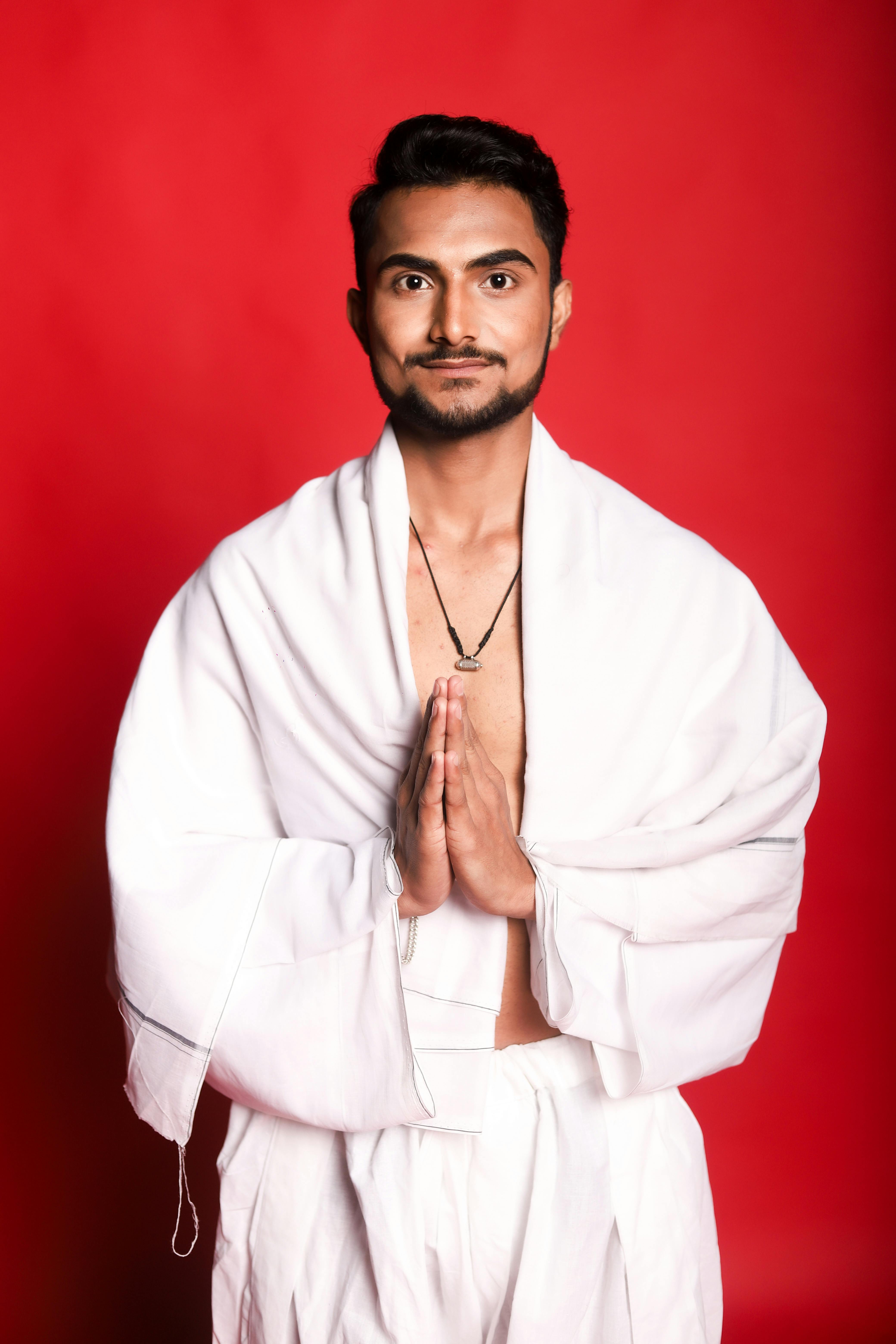 A Man in White Robe Smiling at the Camera · Free Stock Photo