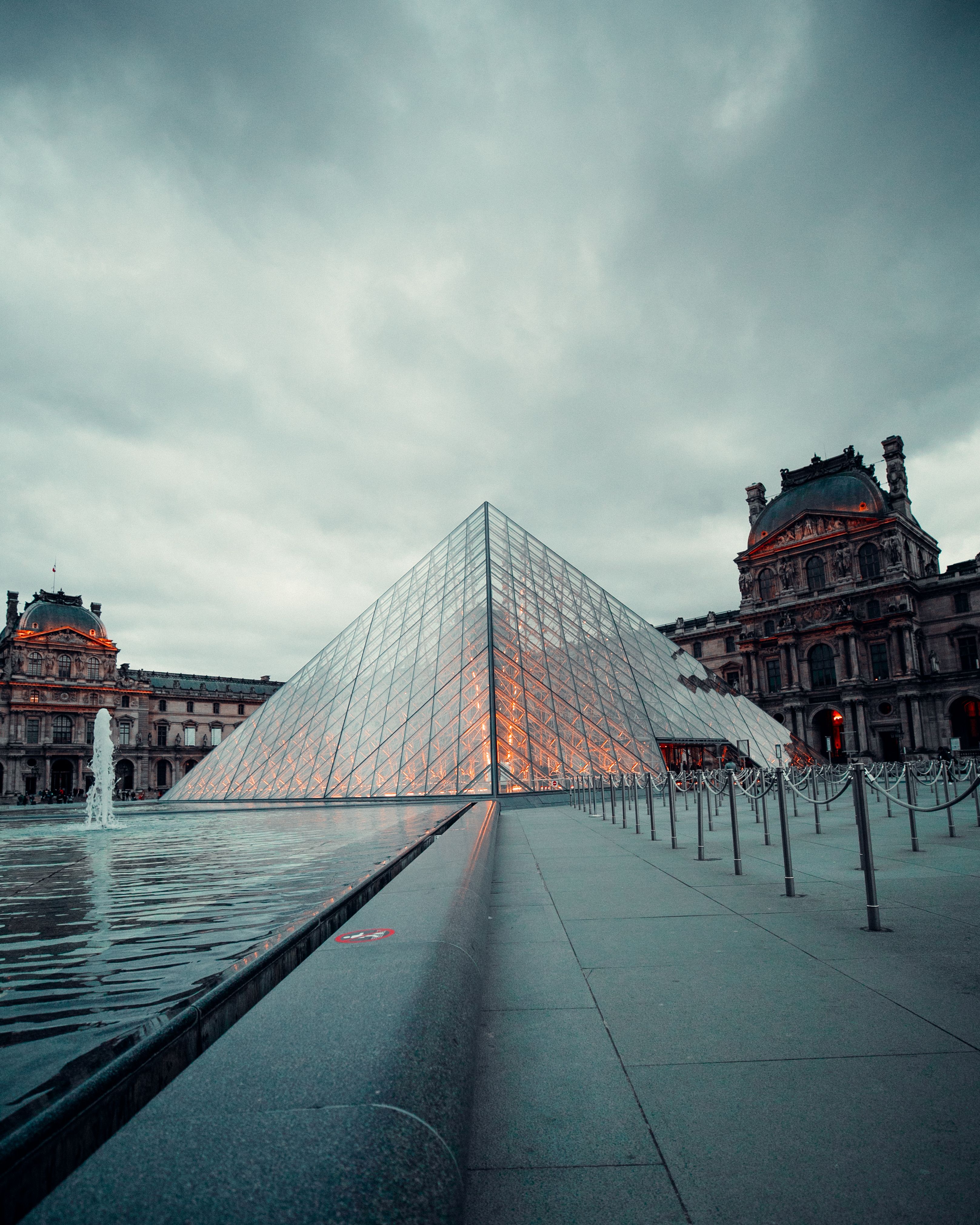 Facade of the Louvre and the Pyramid in Paris, France · Free Stock Photo