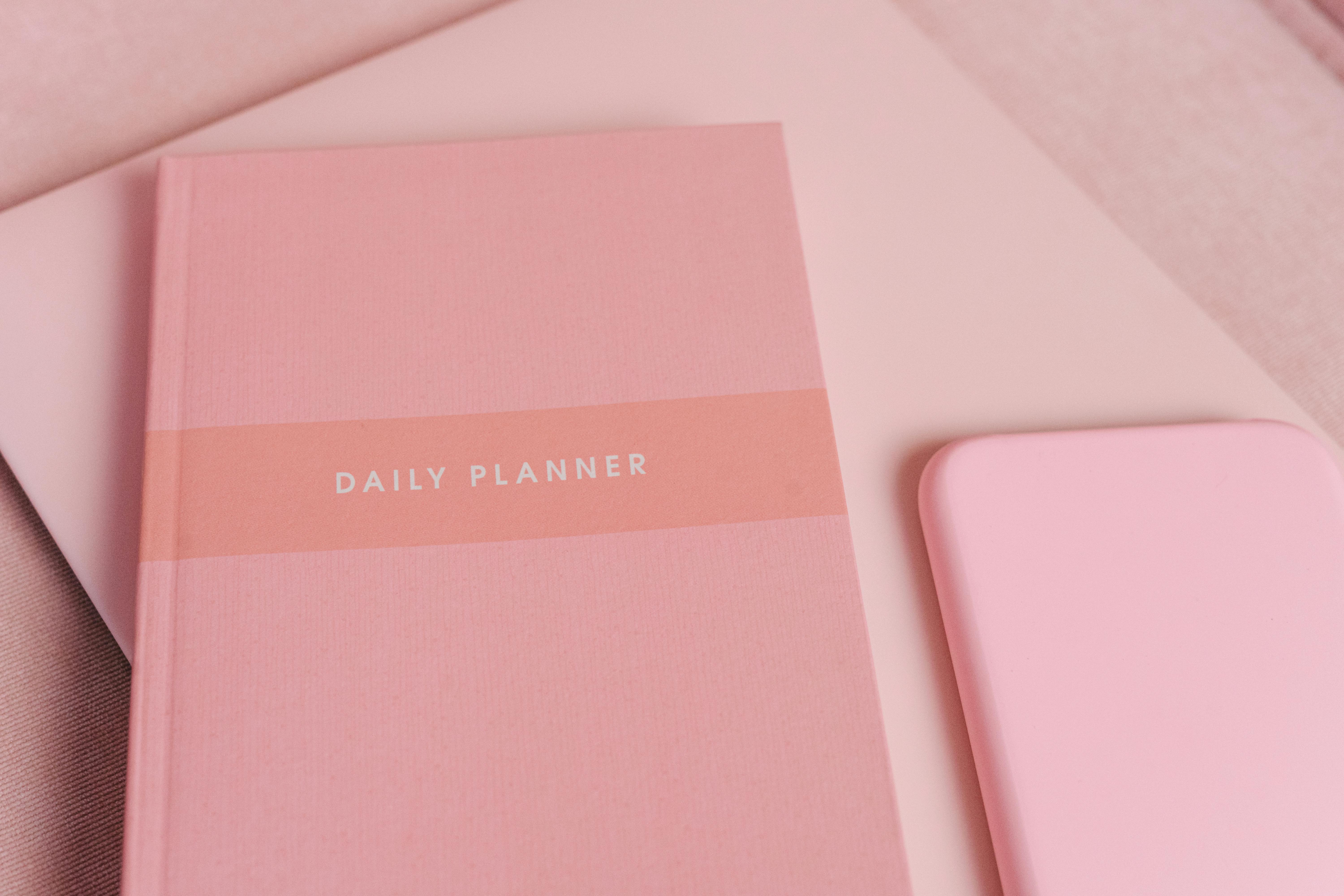 A Pink Planner on the Table · Free Stock Photo
