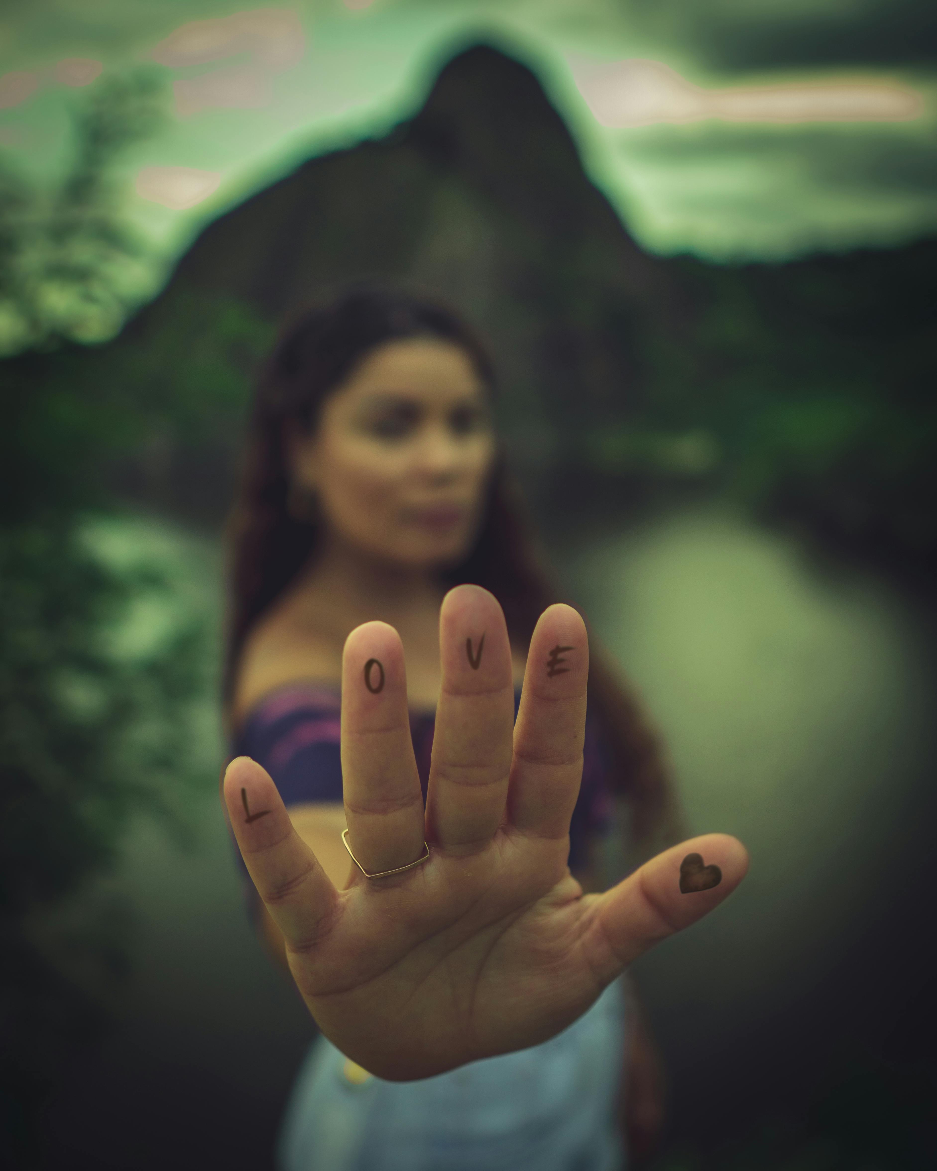 Selective Focus Photo of Person's Left Hand · Free Stock Photo