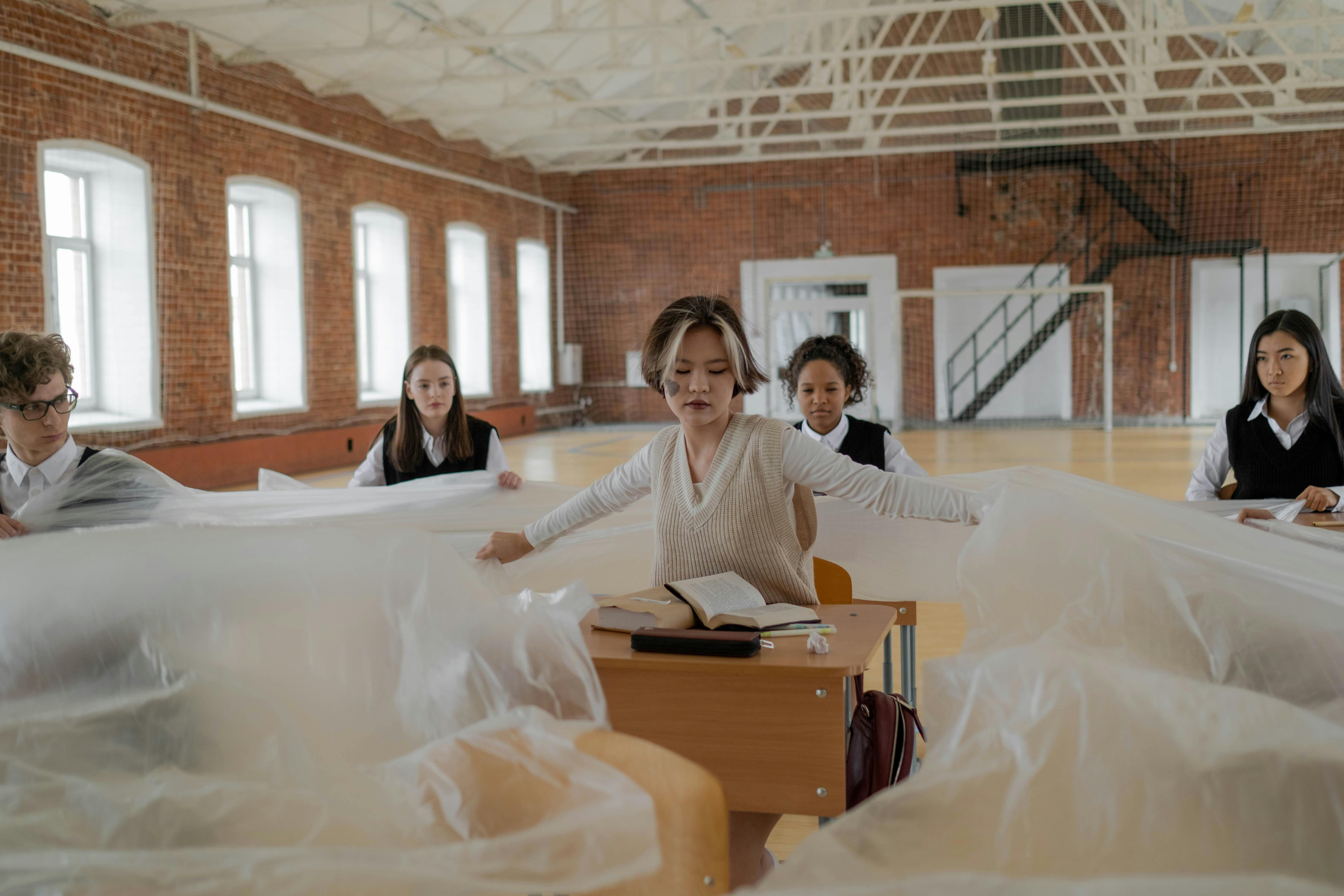 Students Sitting at the Table · Free Stock Photo